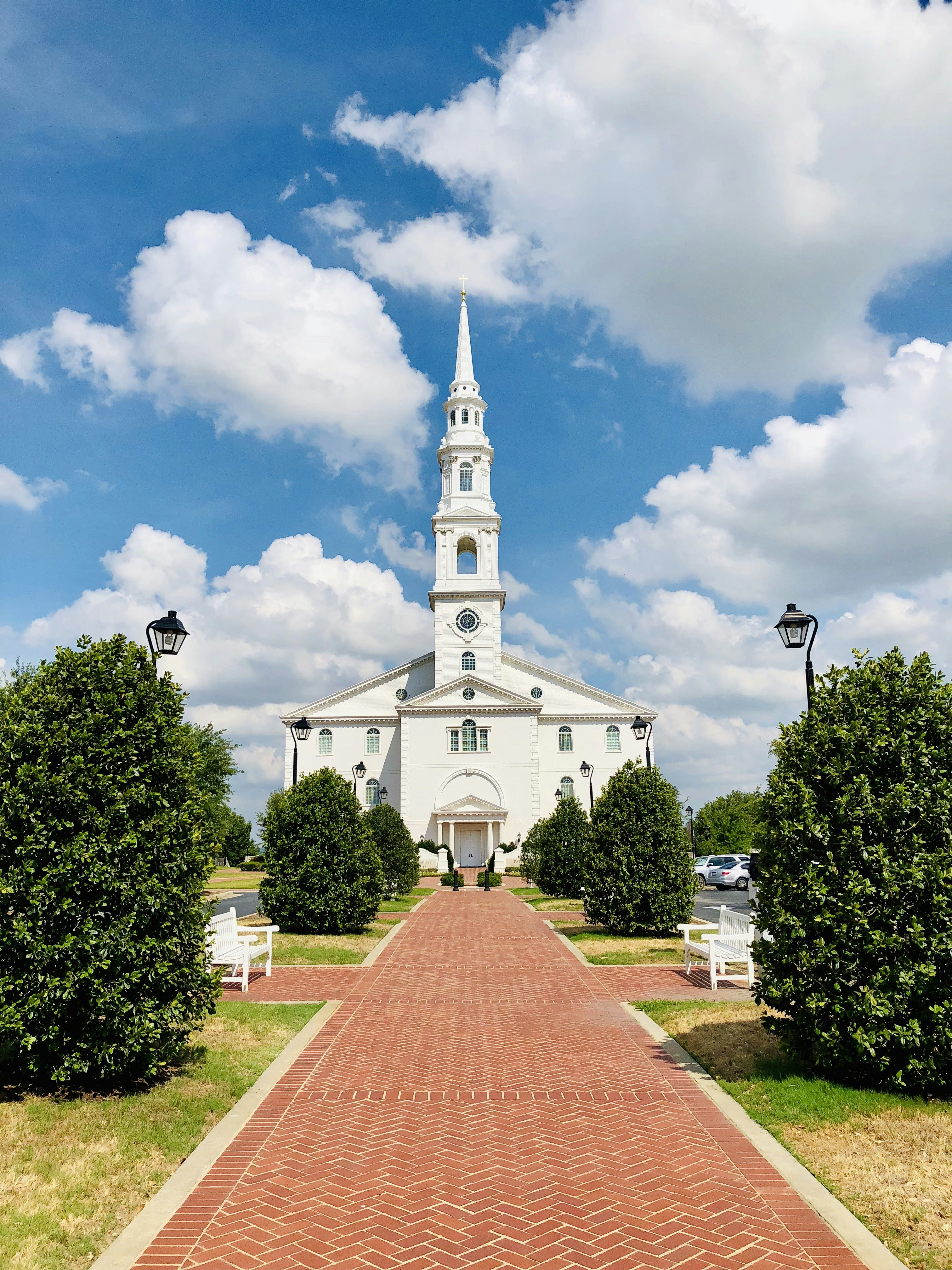 White and brown concrete church under blue sky during daytime photo ...