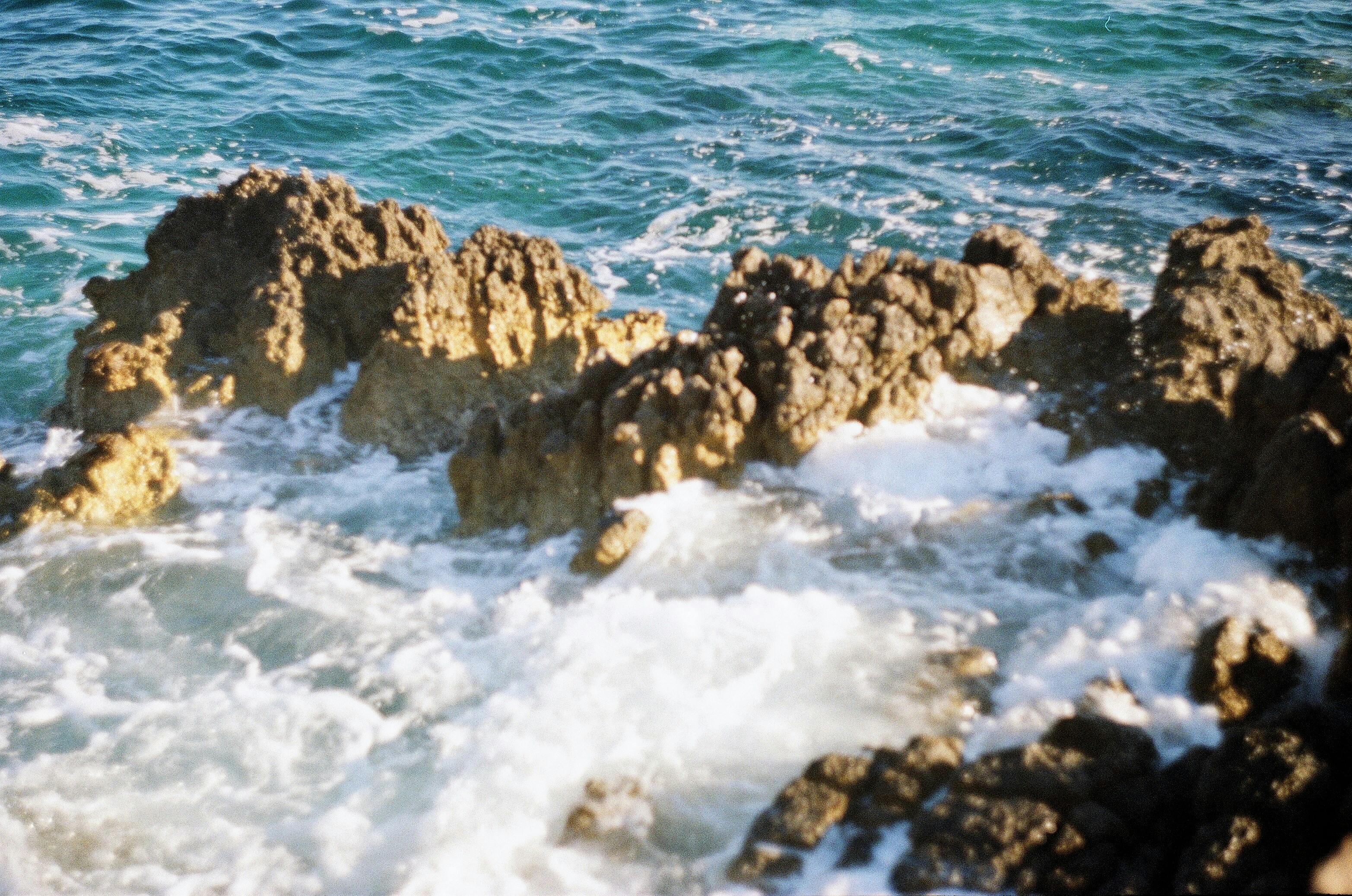 White and brown rock formation near body of water during daytime photo ...