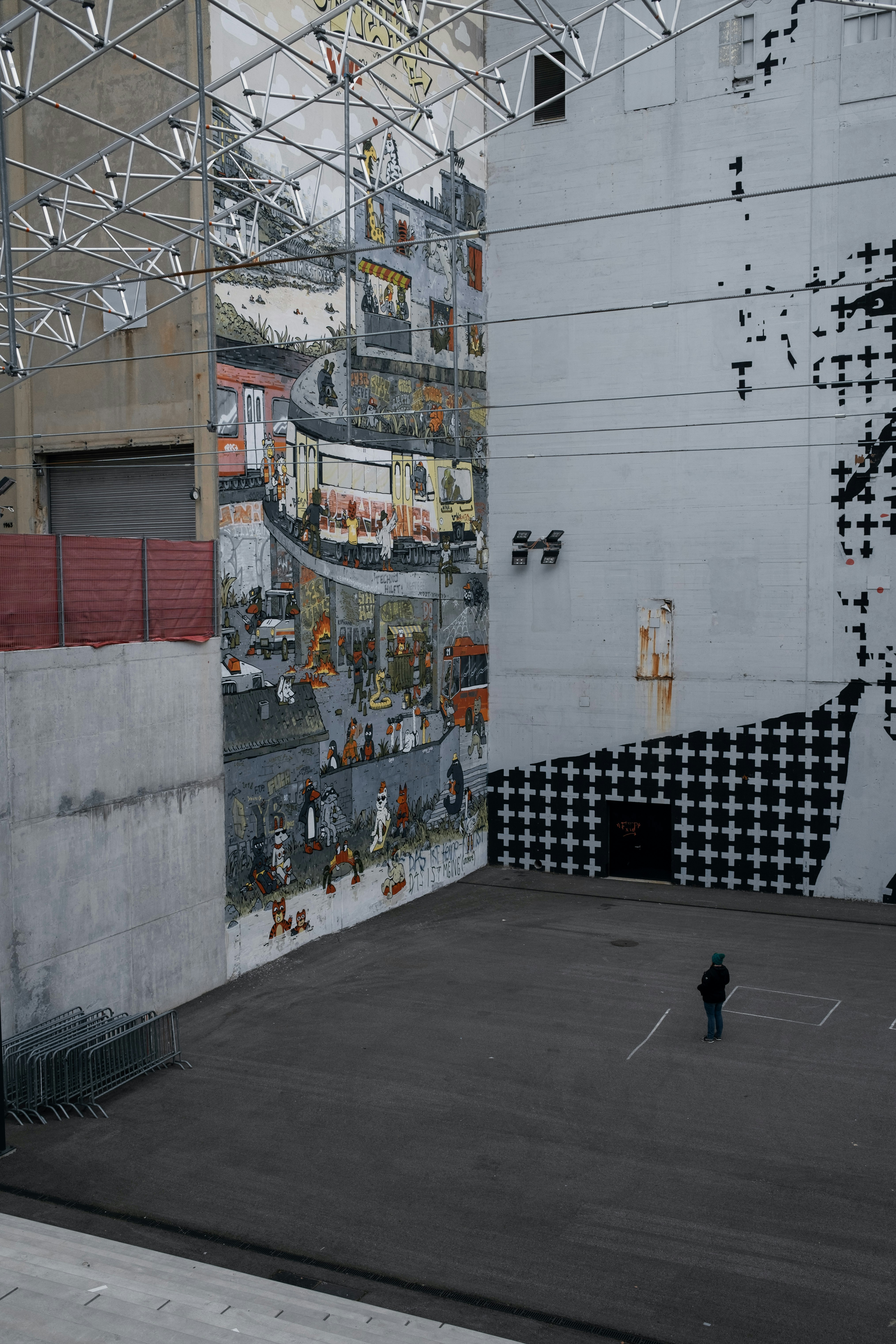 Solo Figure in a Painted Concrete Courtyard