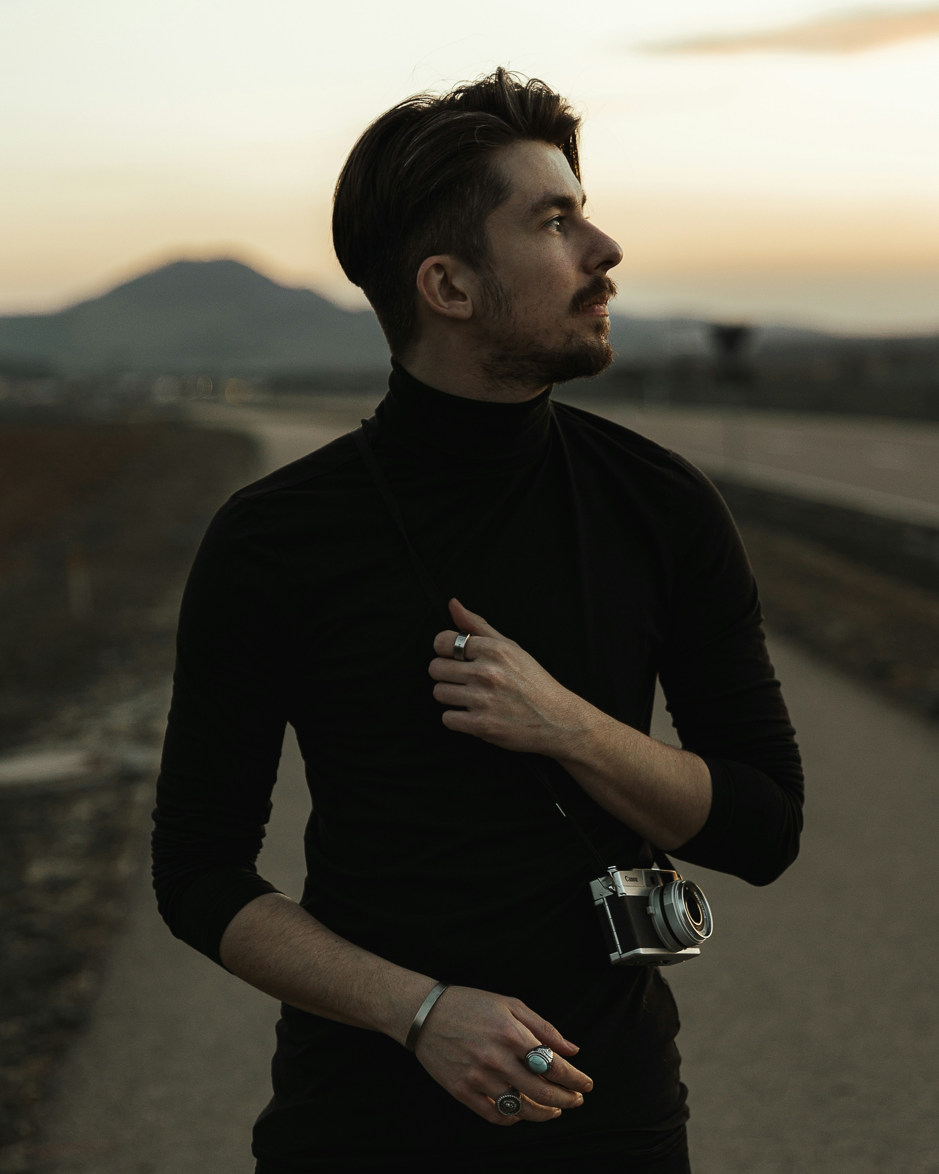 Dusk Portrait on an Empty Road: A Quiet Moment with a Vintage Camera