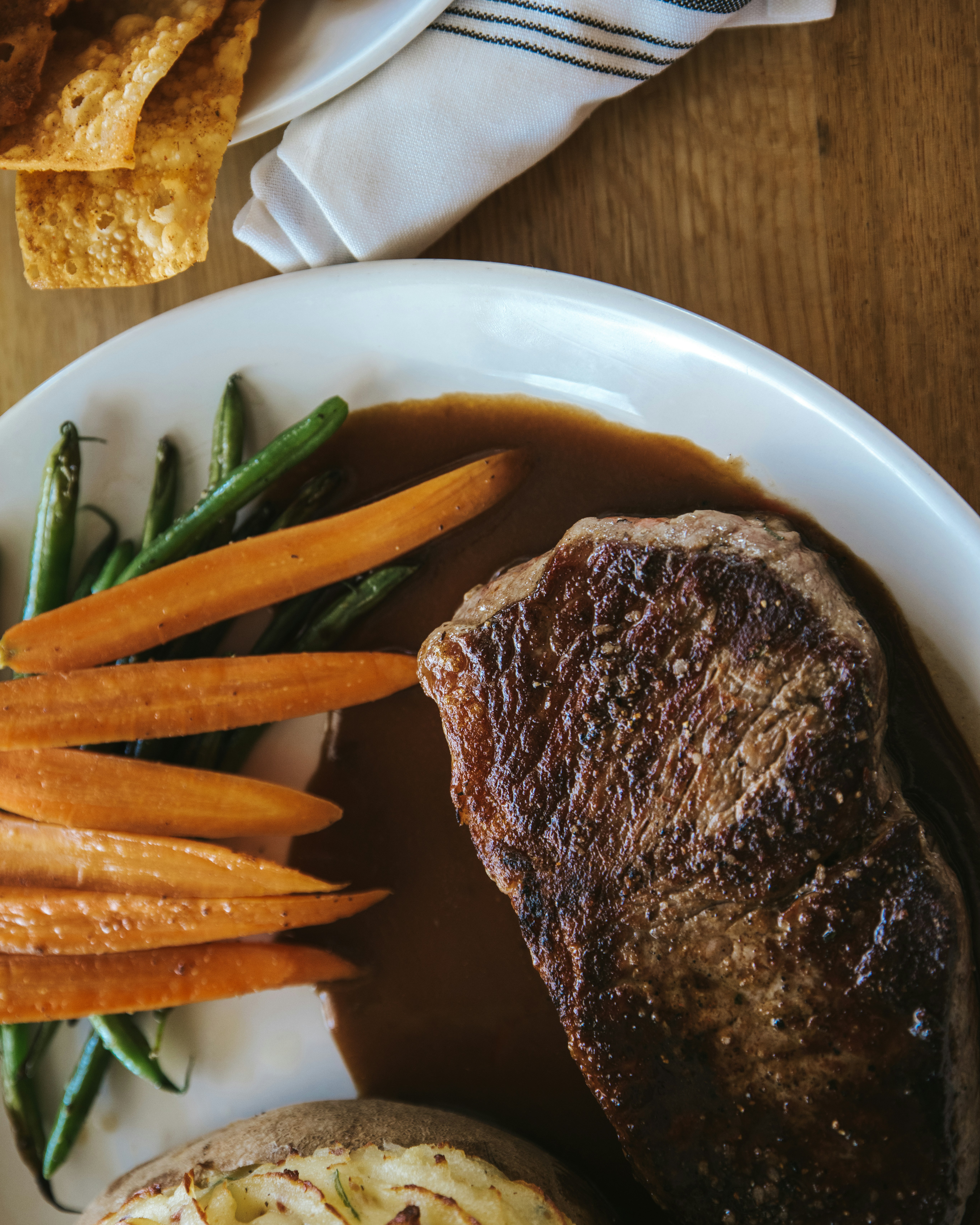 Seared Steak with Glazed Sauce Anchored by Bright Veggies