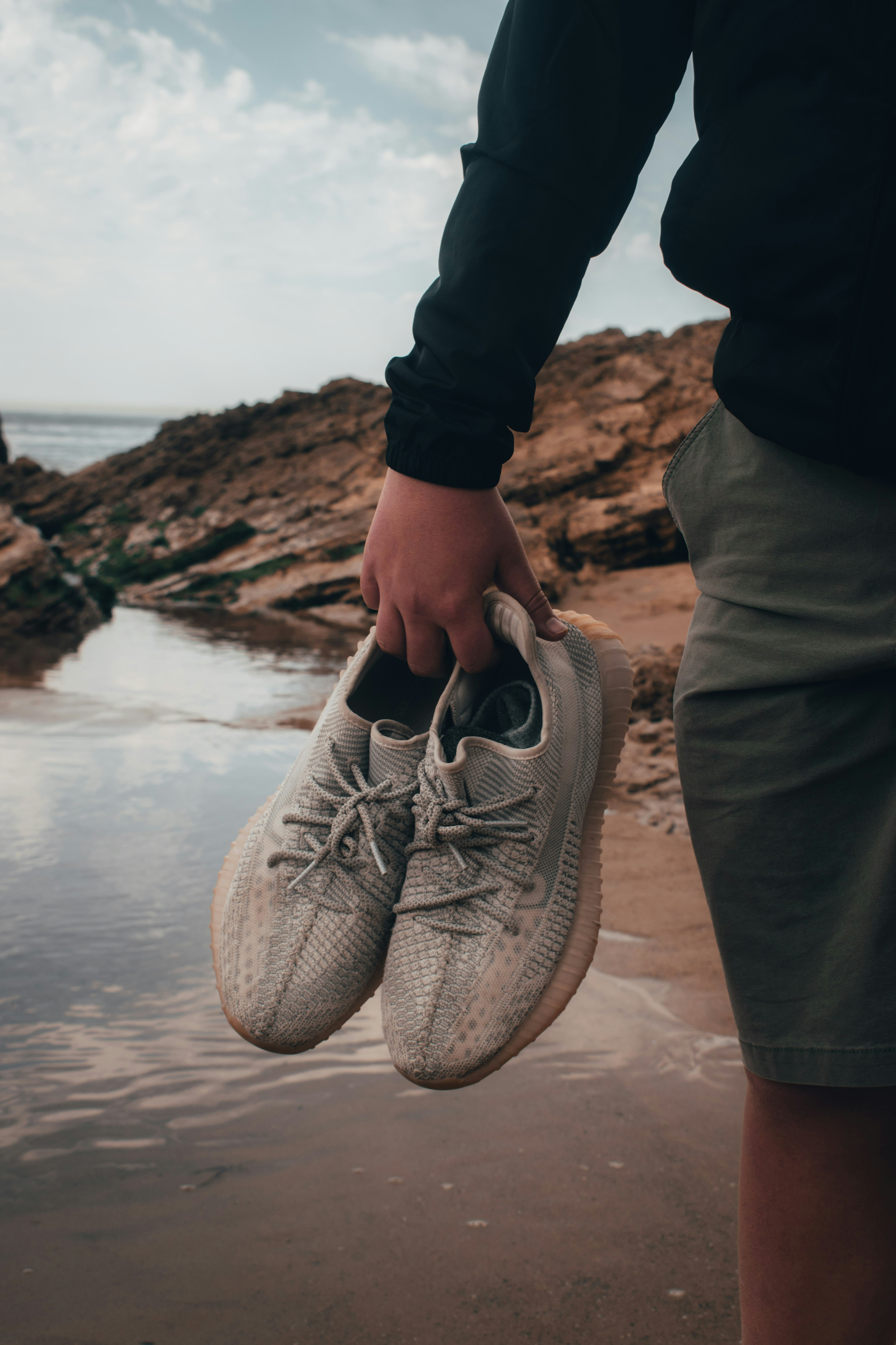 Shorebound Sneakers: A Quiet Moment by the Rocky Coast