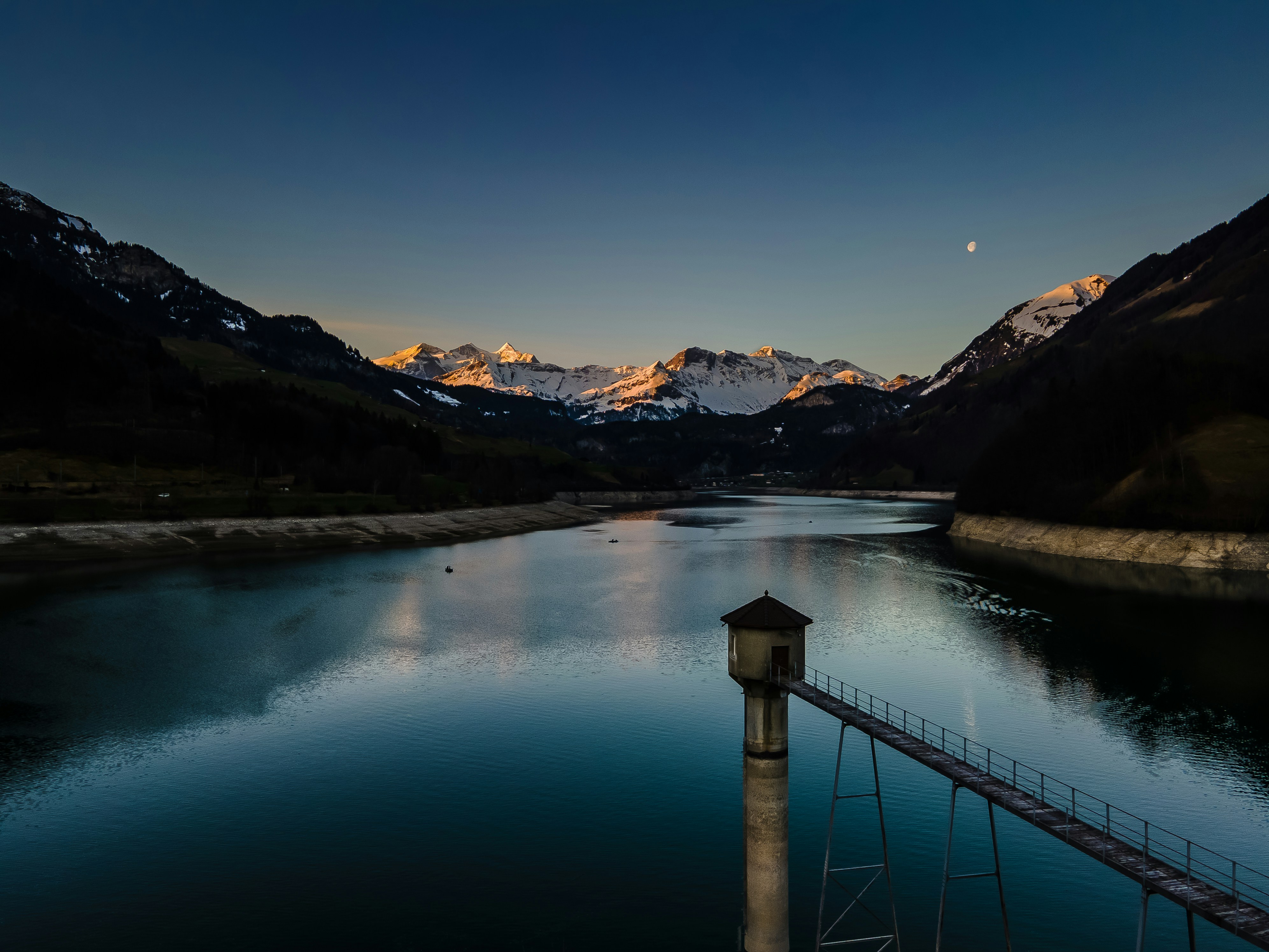 Moonlit Sentinel Over a Mountain-Fjord Reservoir