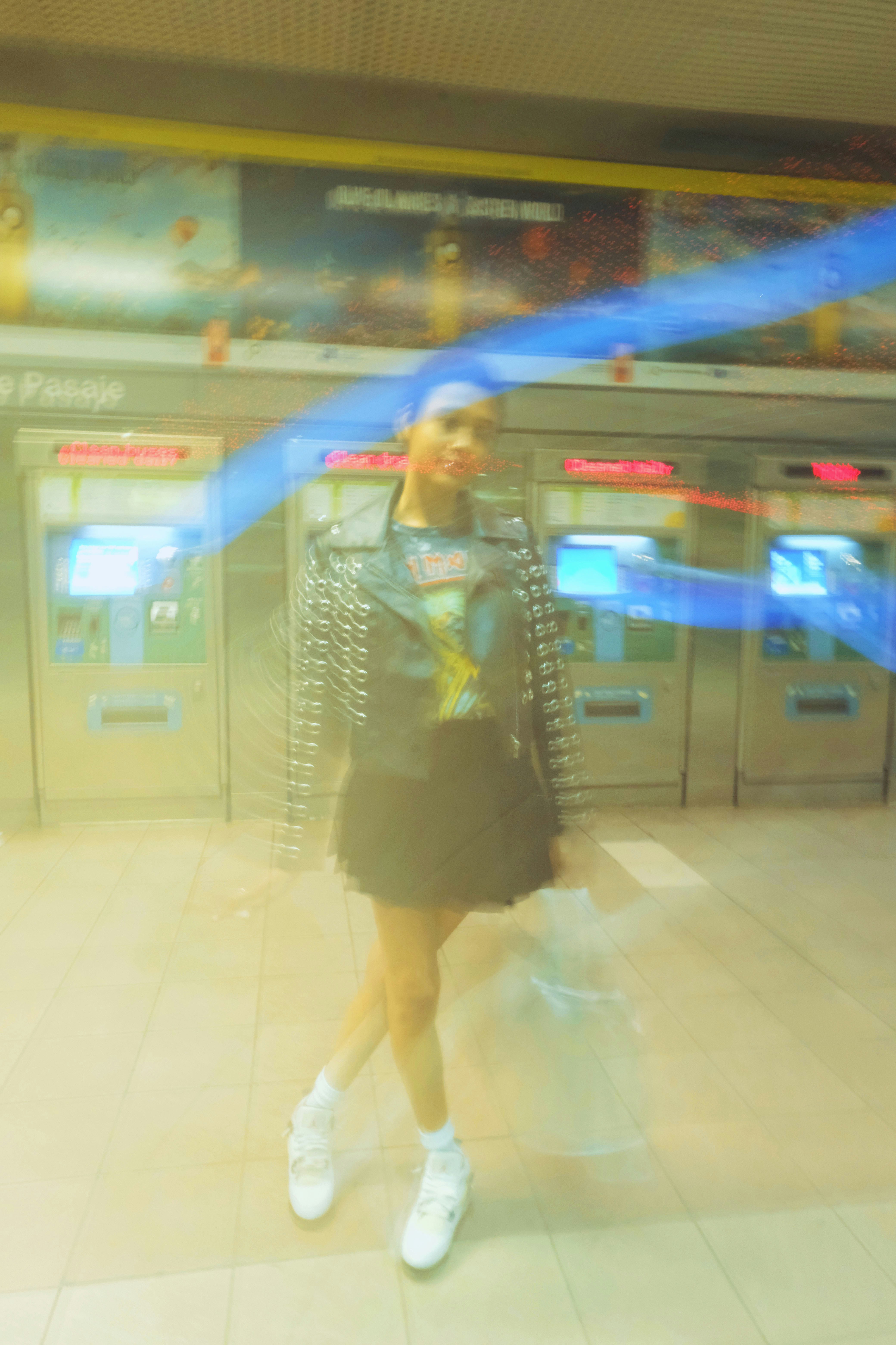 Transit Blur: Neon Light Traces Across a Subway Portrait