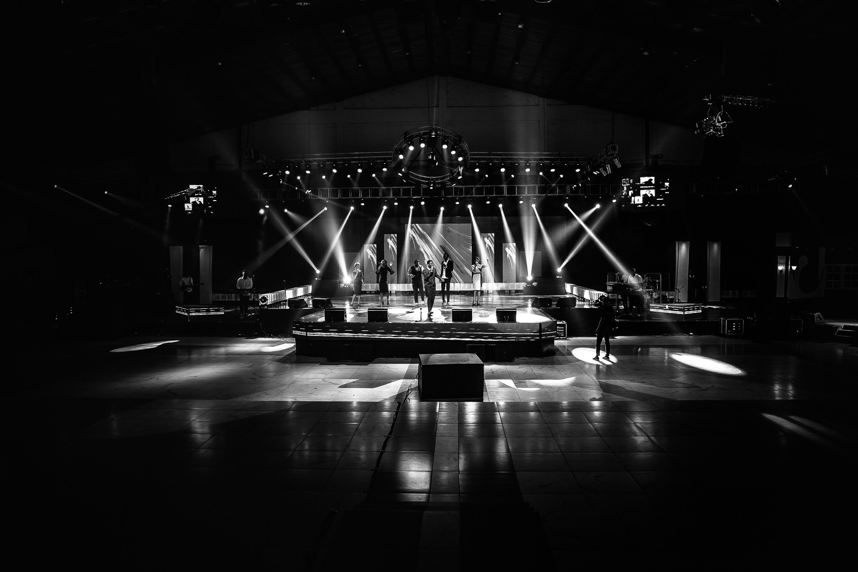 Grayscale photo of stage with lights photo – Free Grey Image on Unsplash