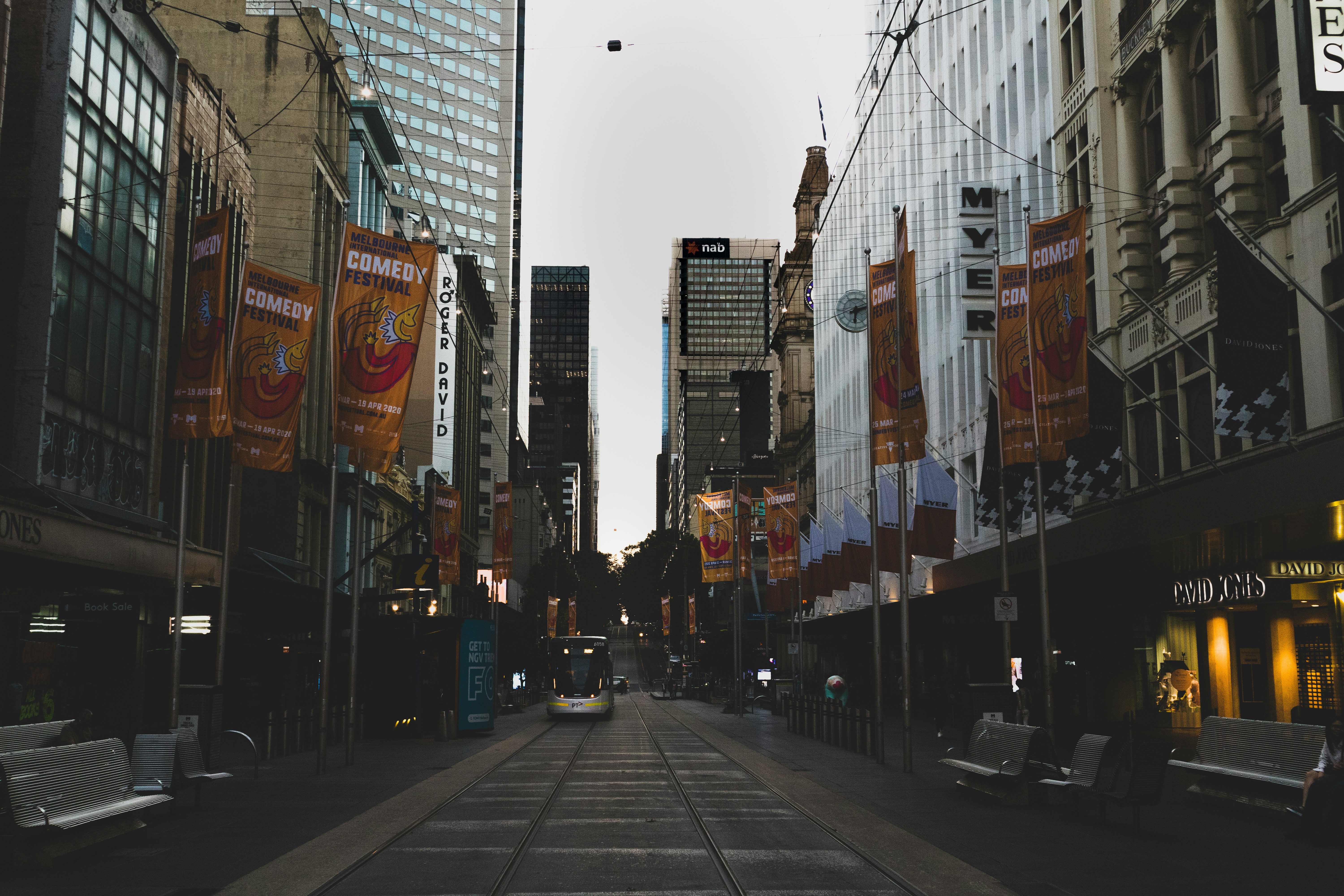 People walking on sidewalk near high rise buildings during daytime ...
