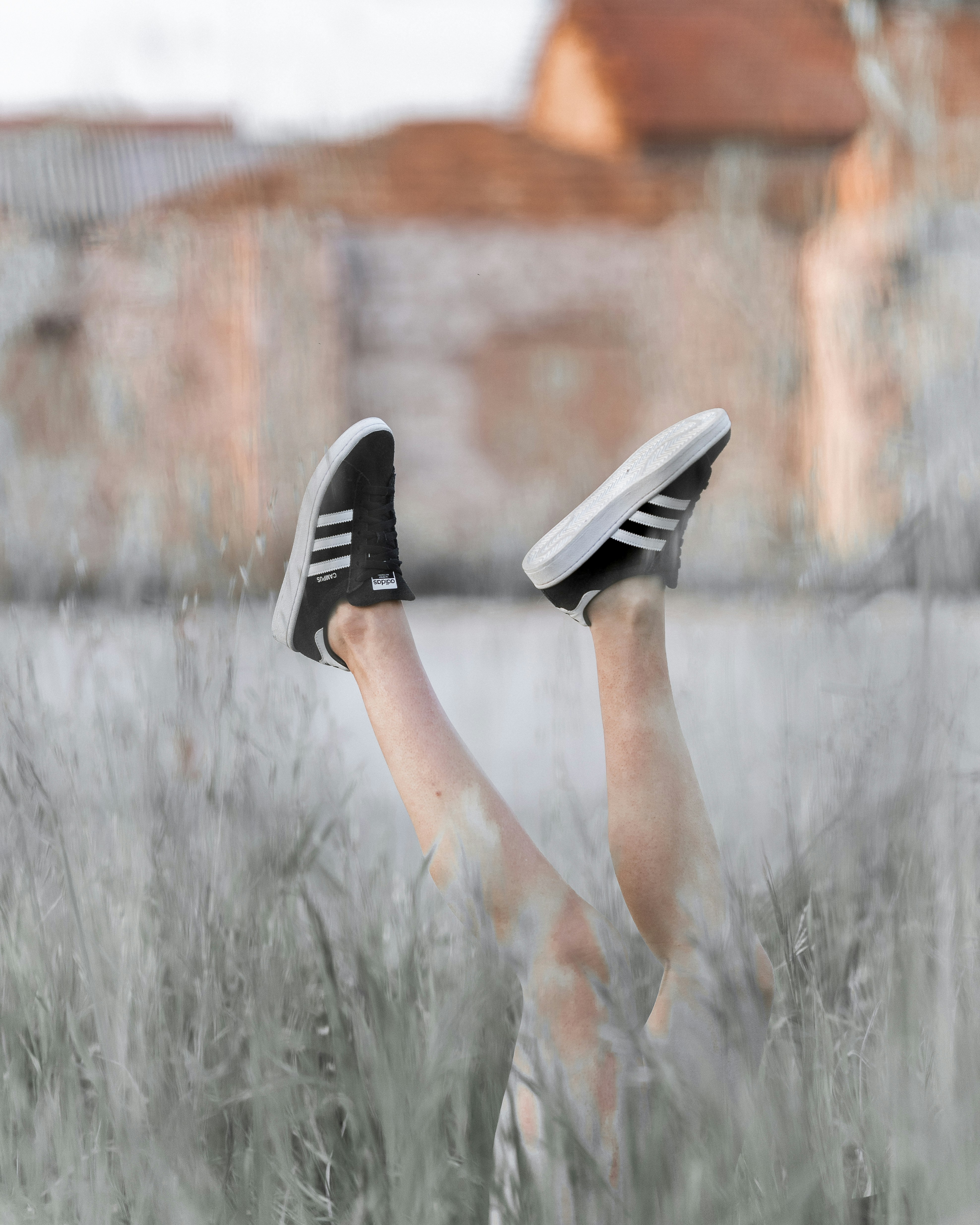 Defying Gravity: Sneakers Hover Over a Quiet Field