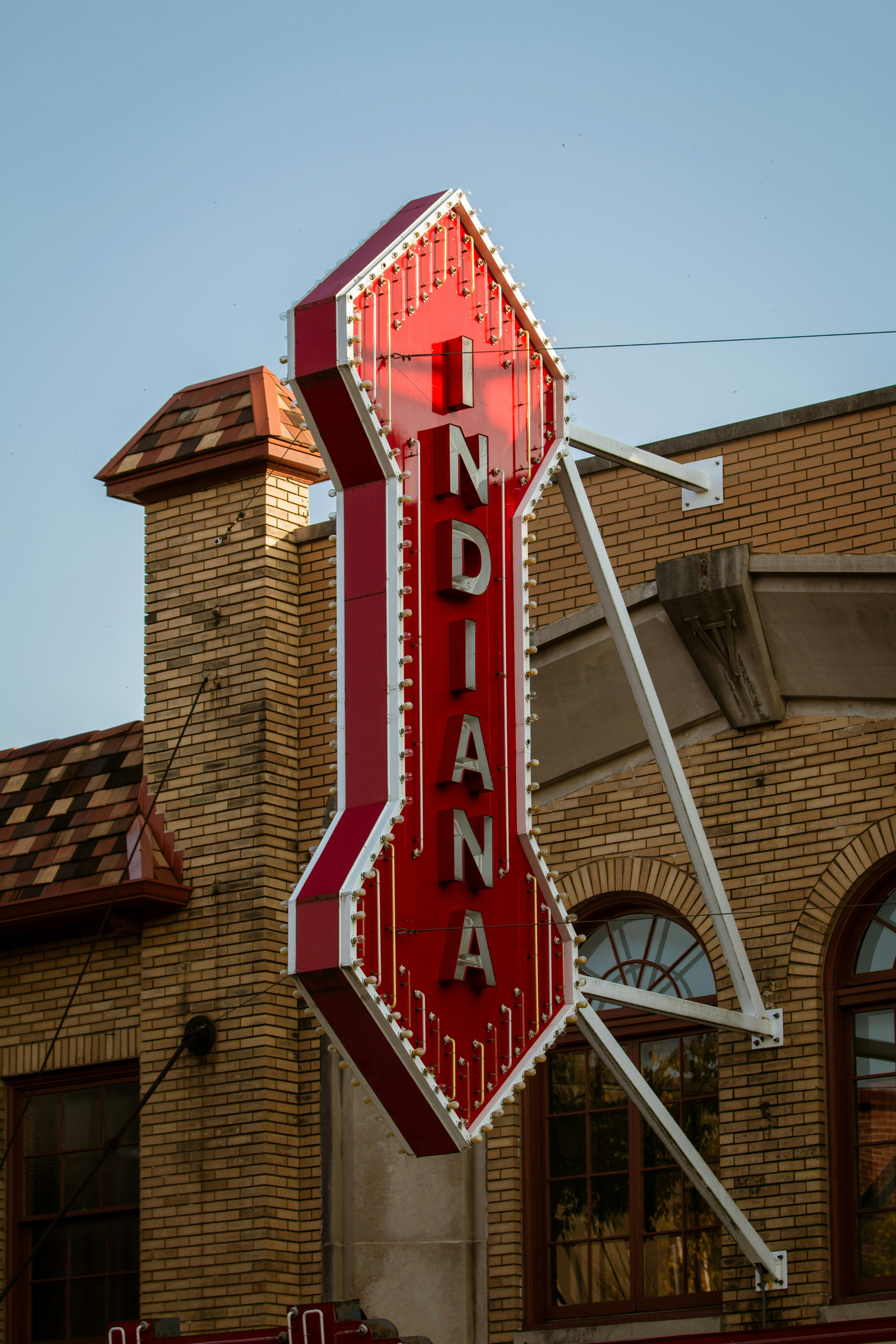 Brown brick building with red and white led signage photo – Free ...