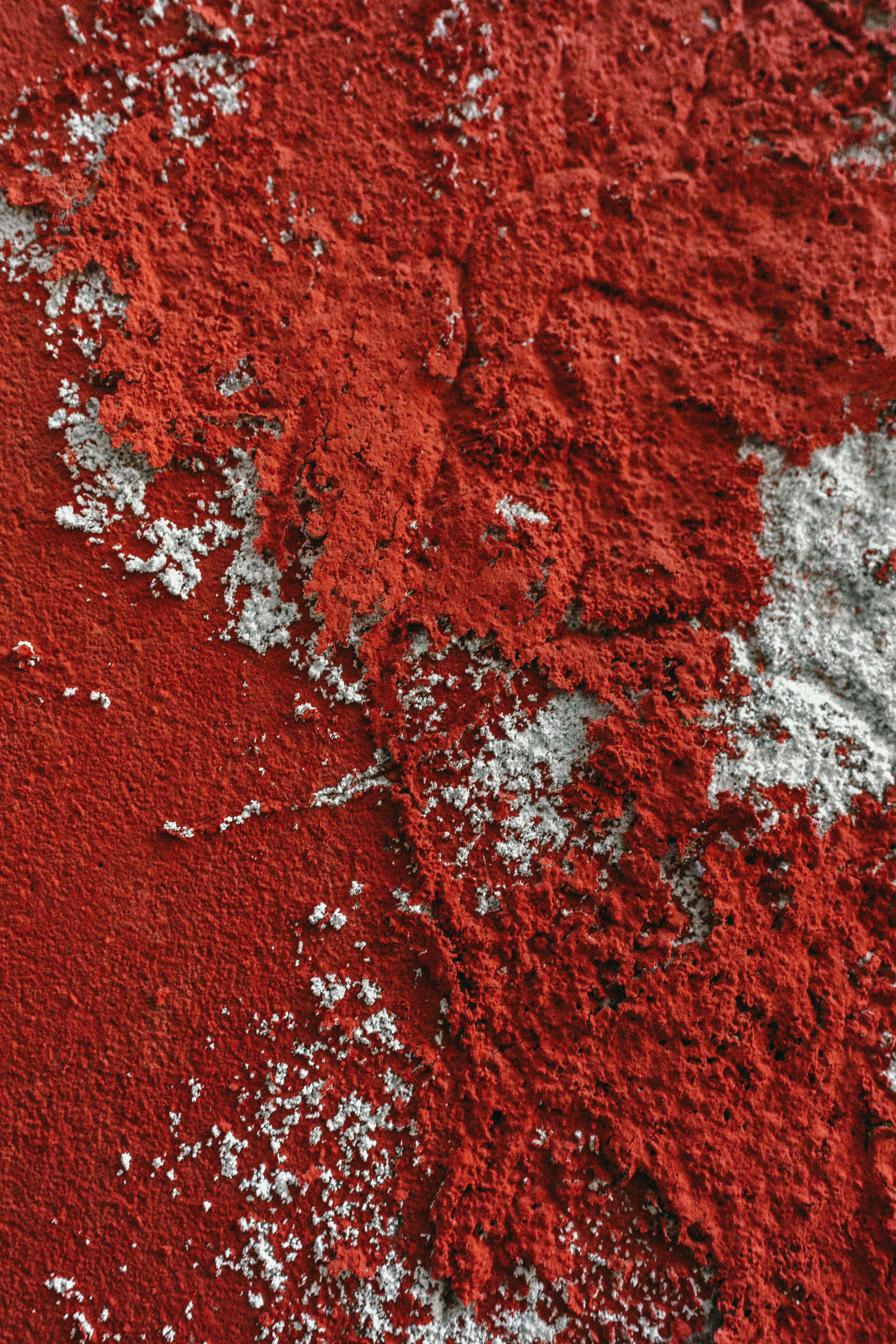 Irony of Color: Red Rust Exposed in Rough Texture