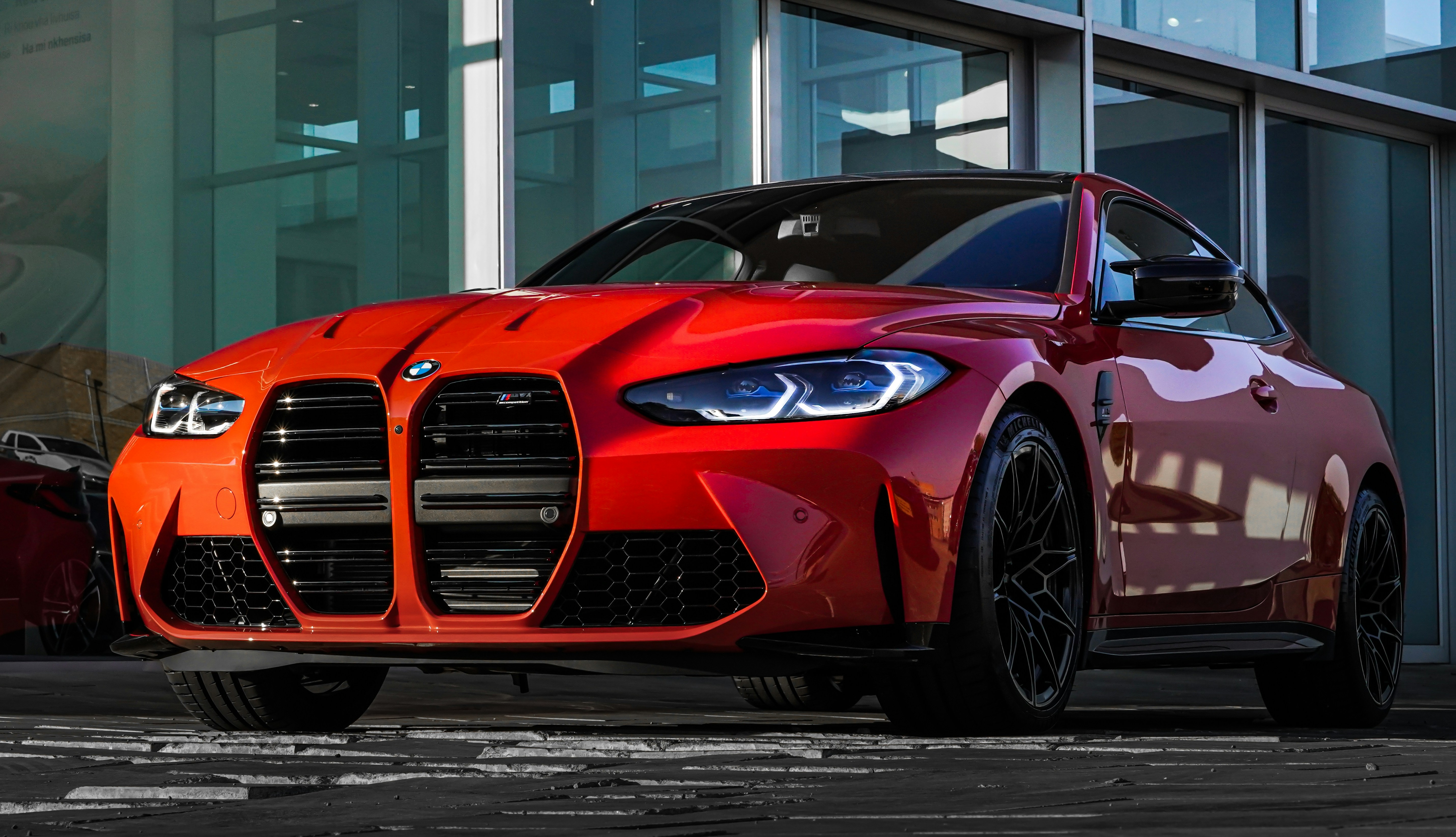 Toronto Red BMW M4 Competition | red bmw m 3 coupe parked in front of white building
