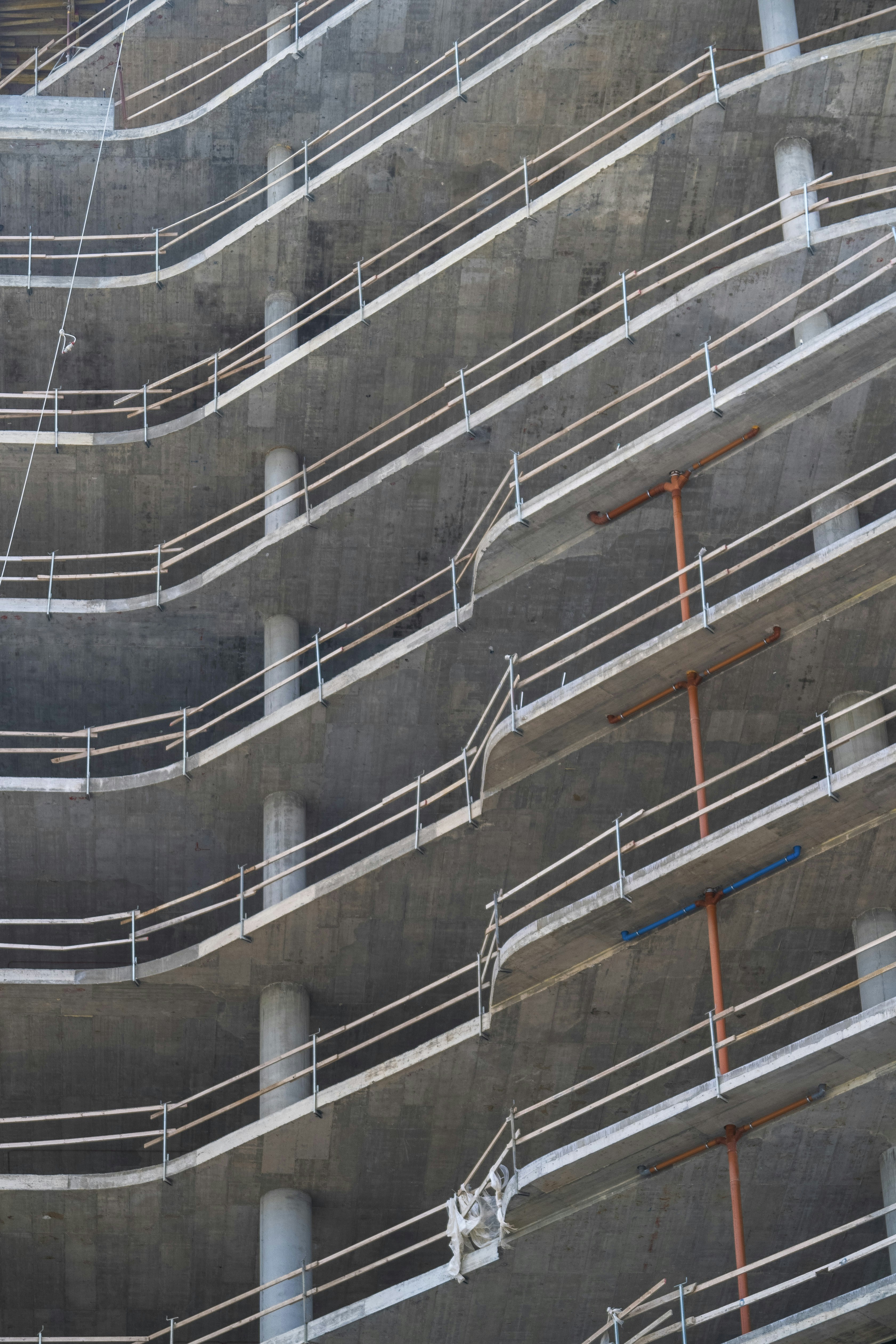 Diagonal Ramps: Concrete Pathways Weaving Through Steel Rails