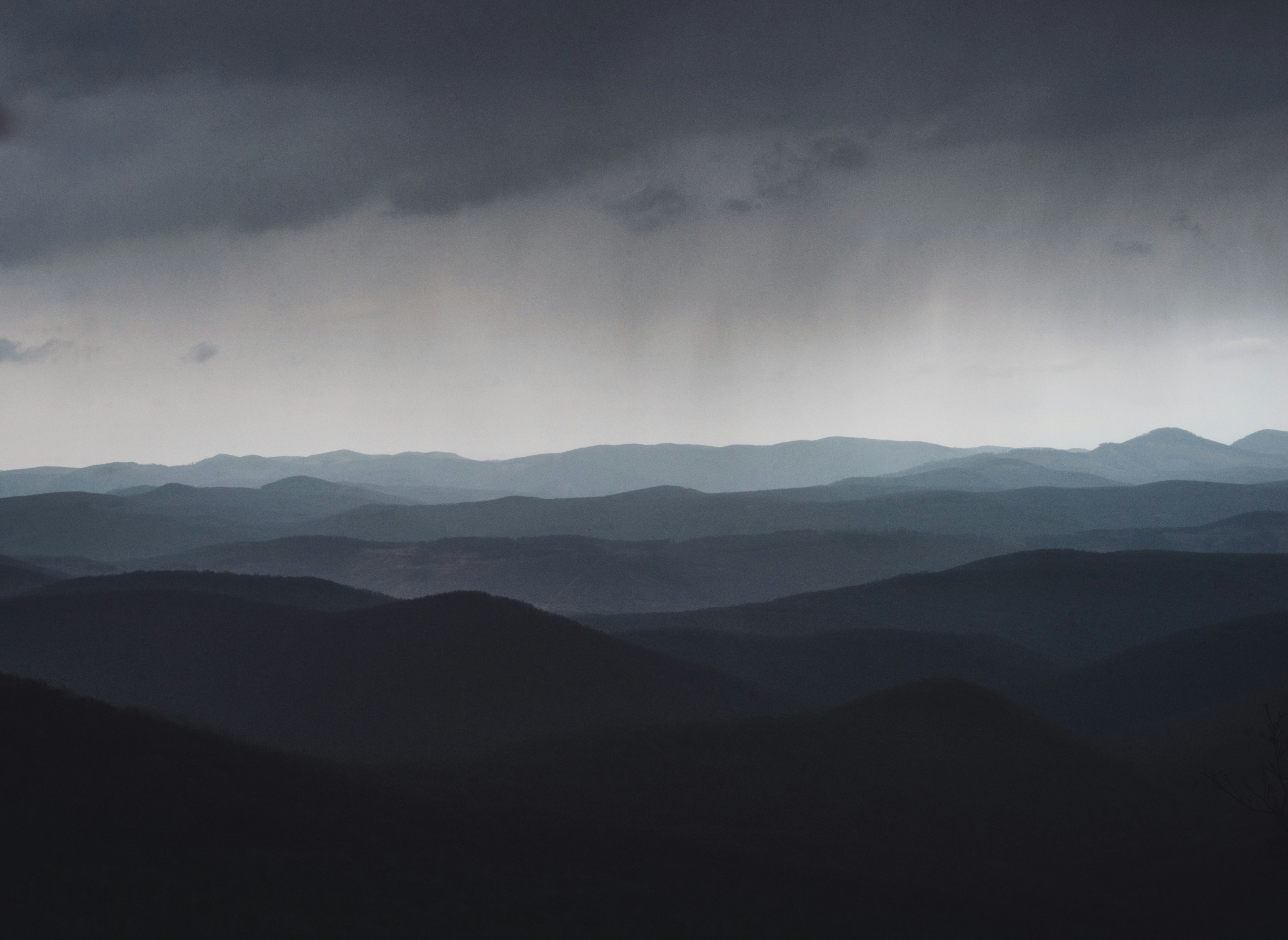 mountains under white clouds during daytimeNorbert Buduczki