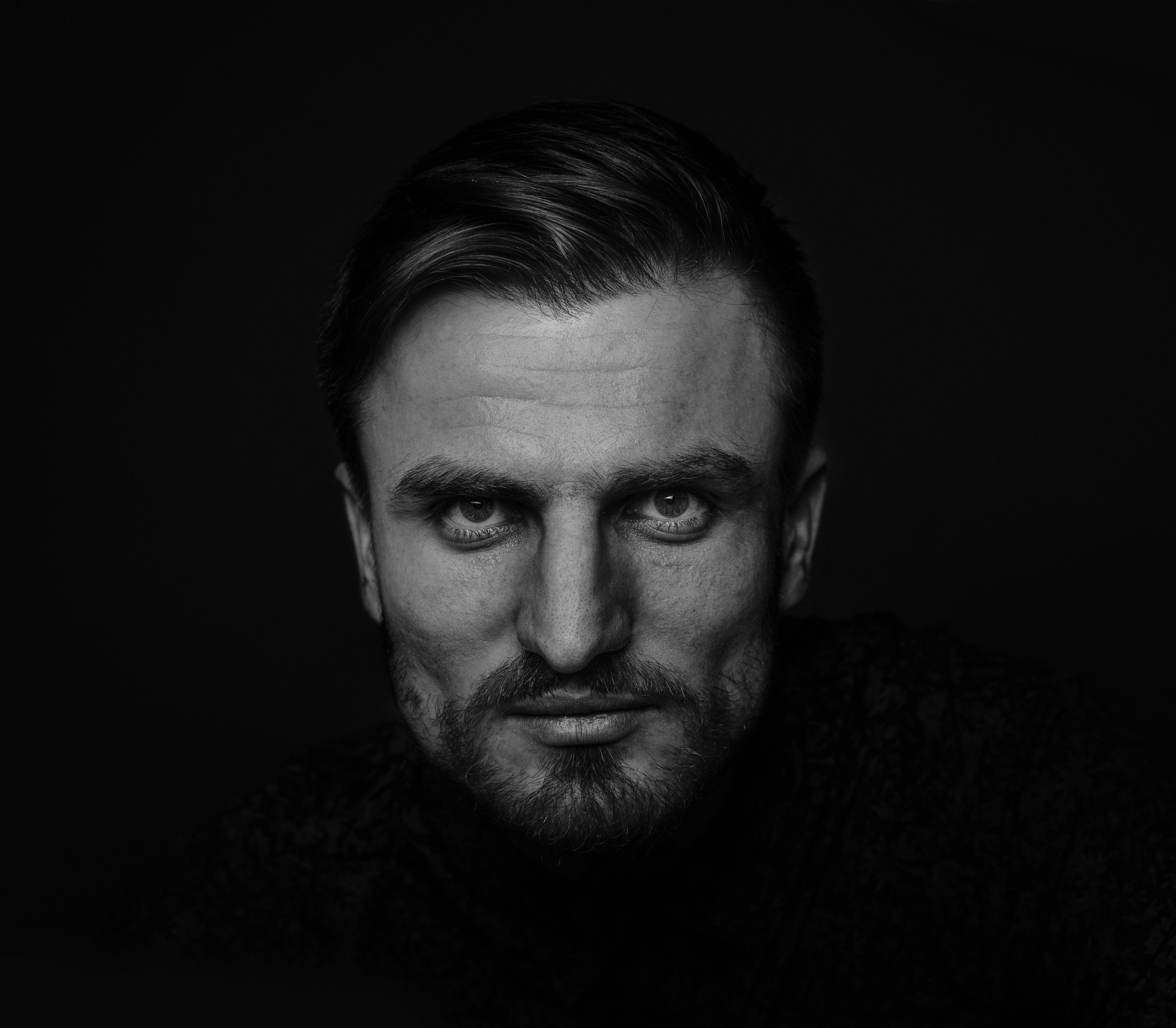 Noir Gaze: Close-Up Portrait in Shadow and Light