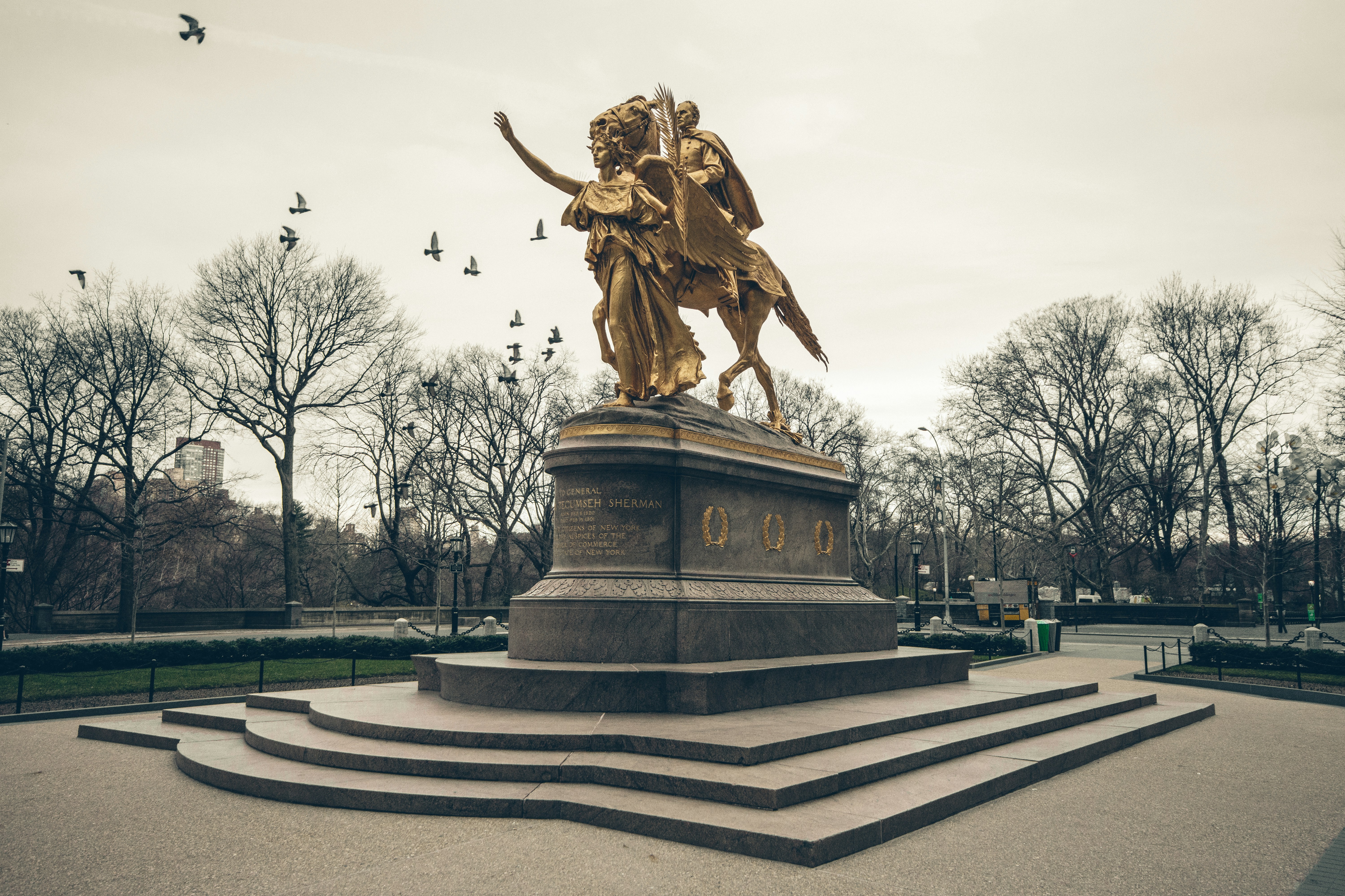 Gold statue of man on park during daytime photo – Free Central park ...