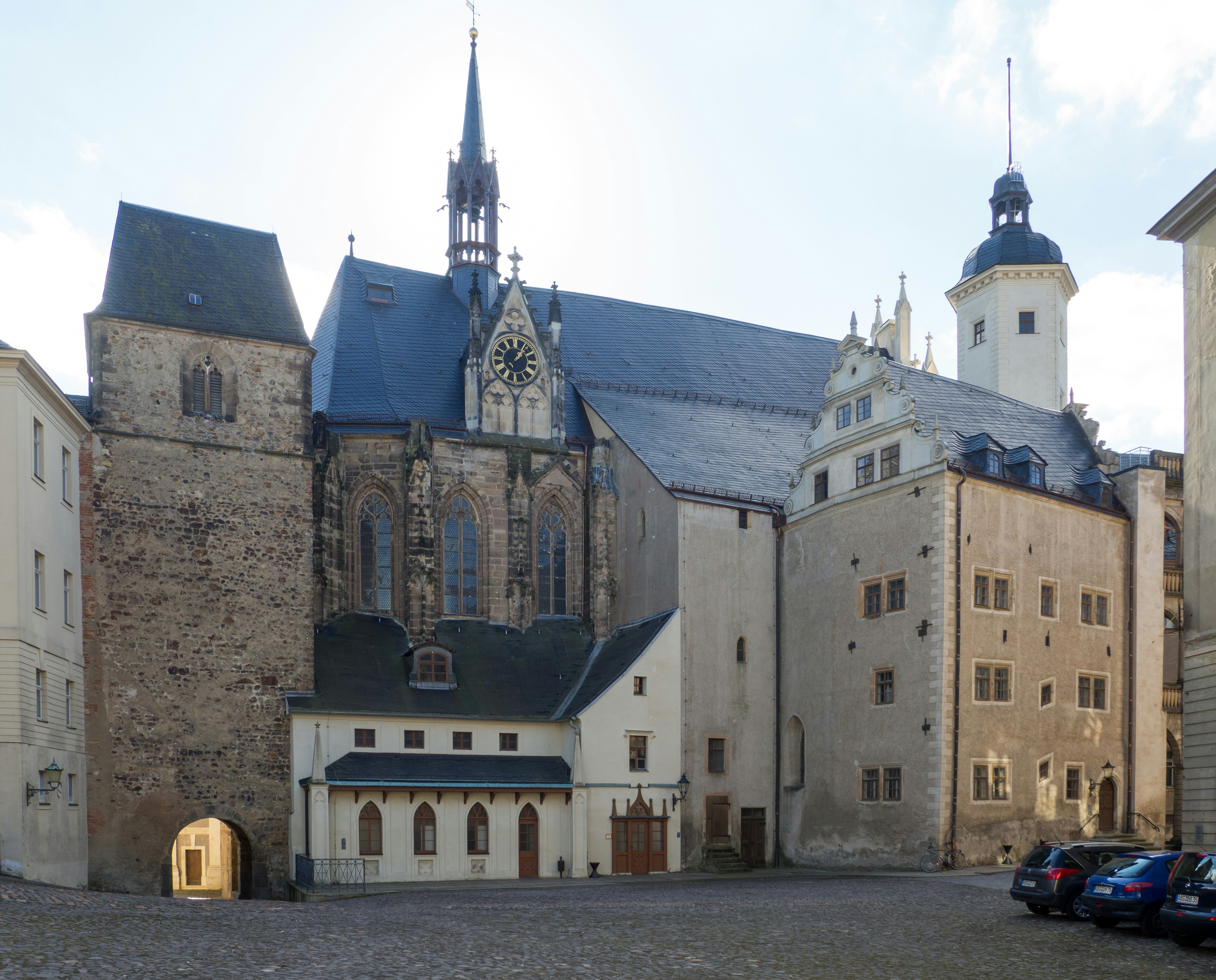 Cathedral Facade in Daylight: A Cobblestone Square Chronicle