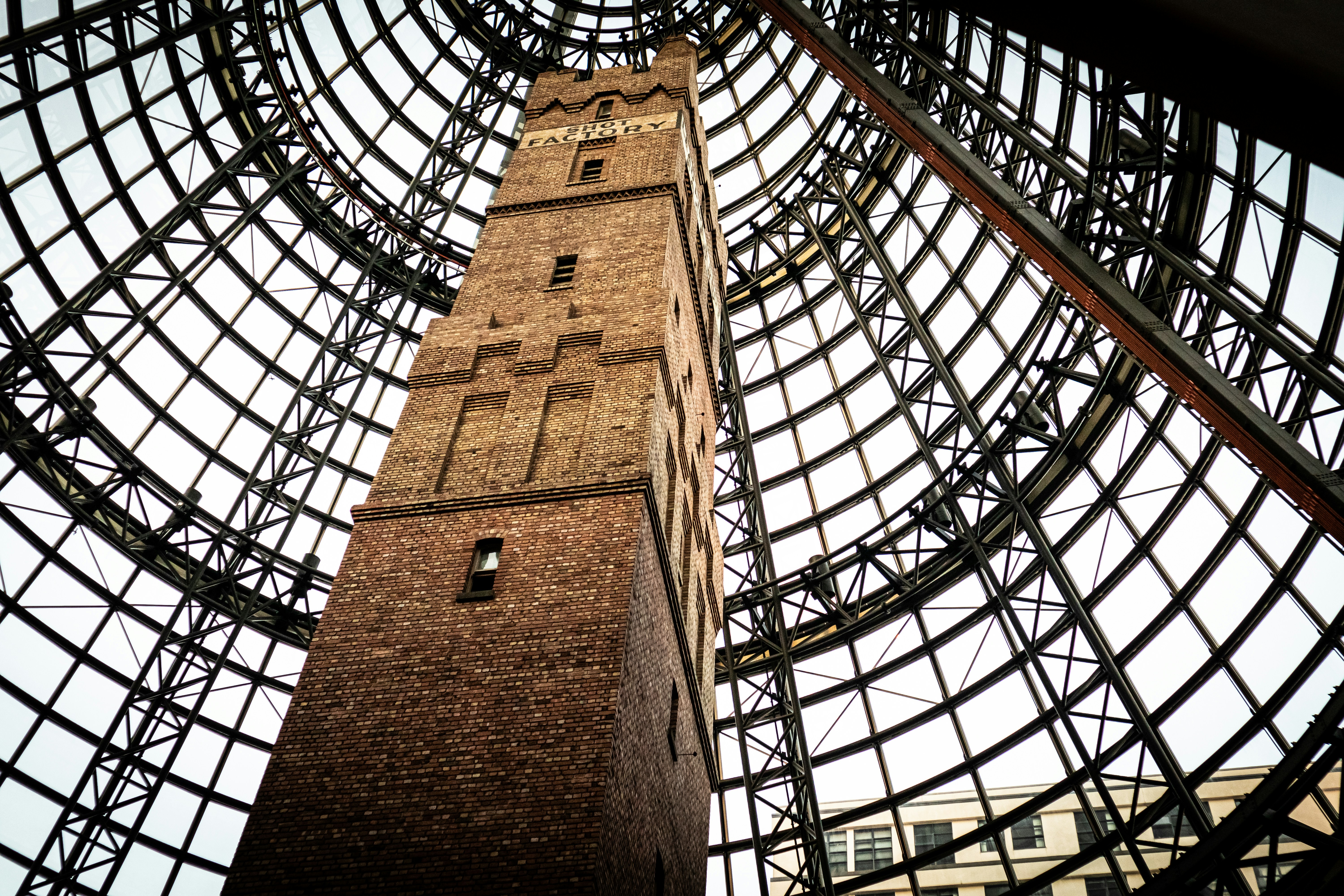 Brick Sentinel Encircled by a Crown of Glass