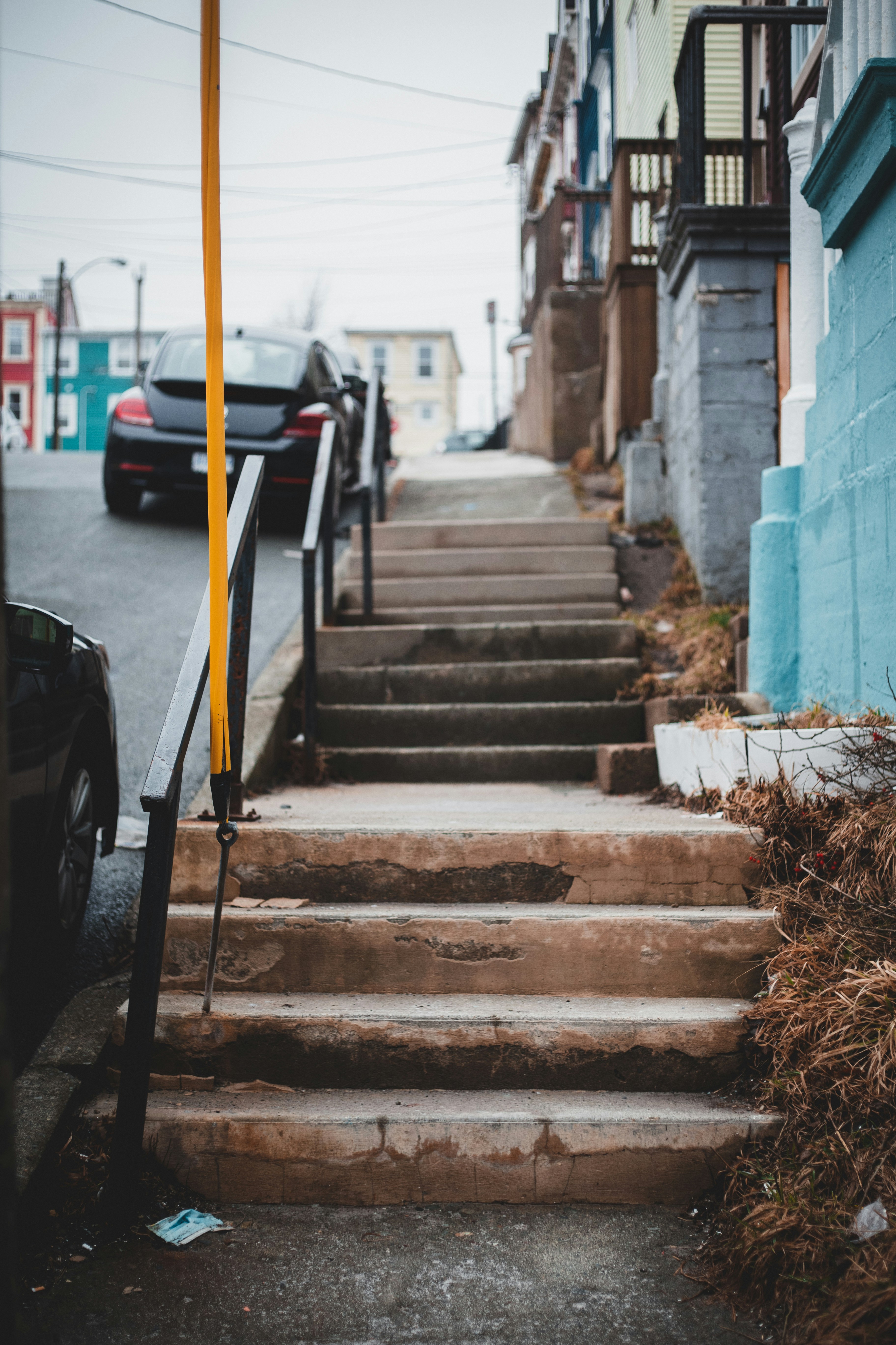 Stairway Up a Hill Between Pastel Facades