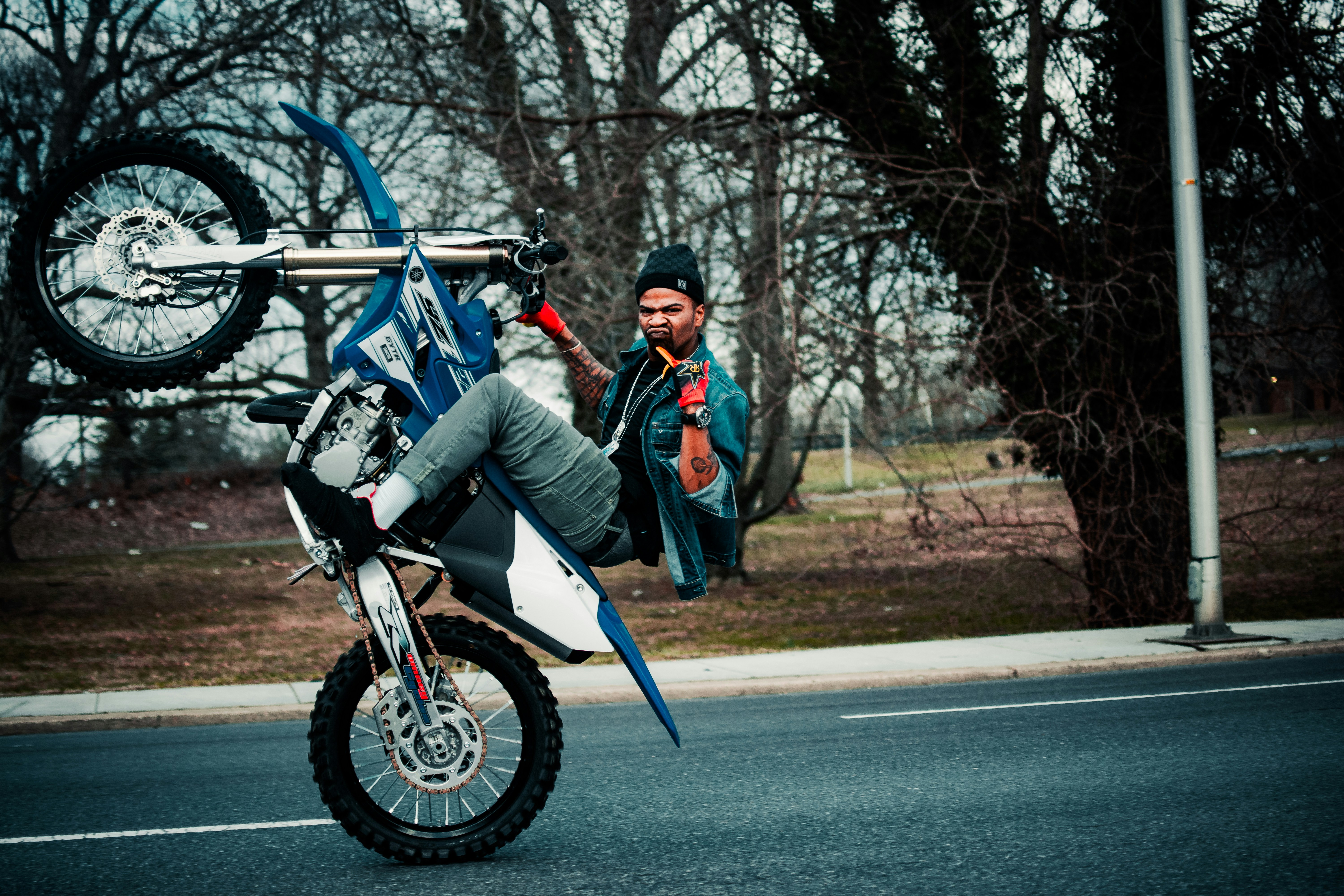 Man in black jacket riding blue and white motorcycle photo – Free ...