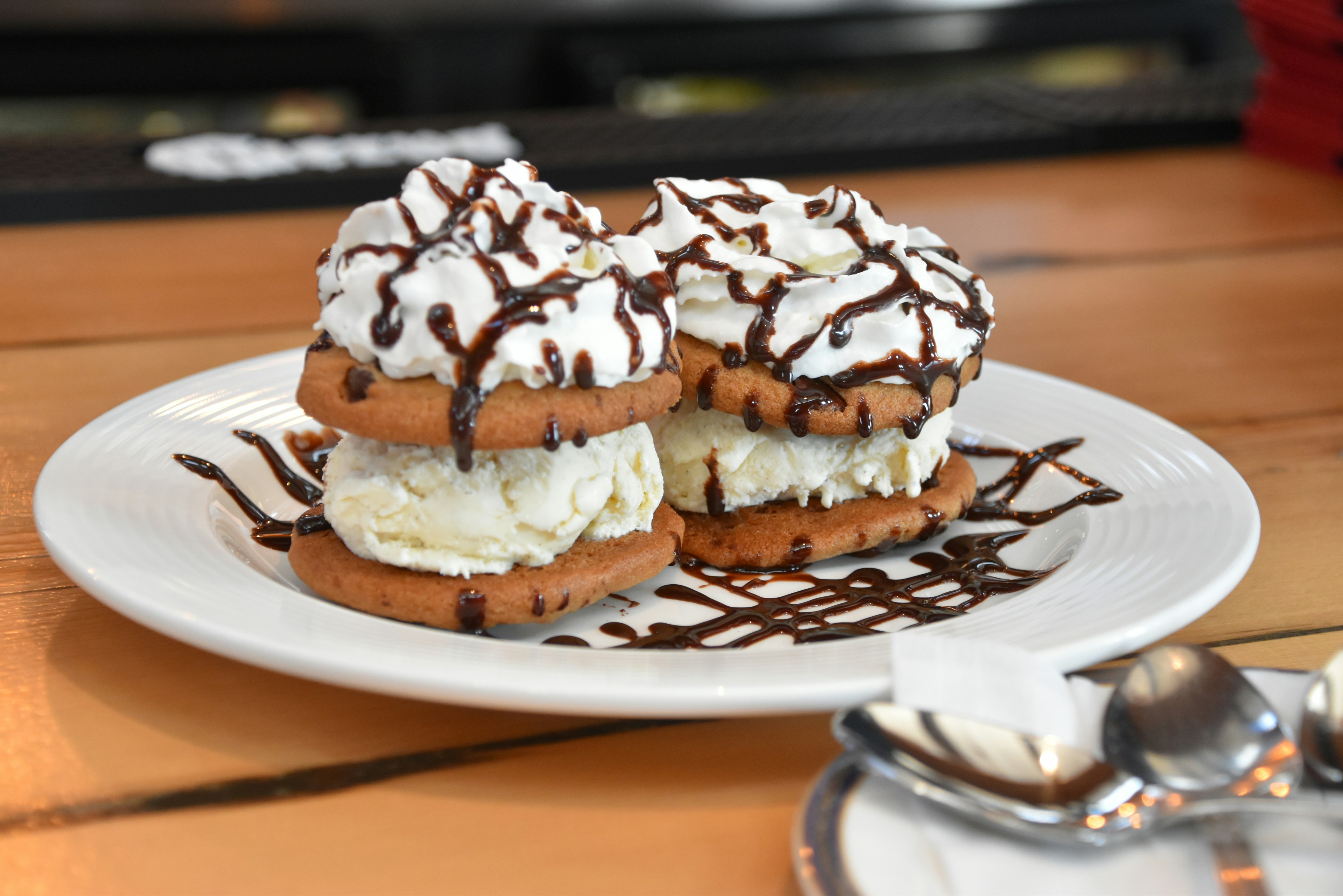 Vanilla Ice-Cream Sandwiches Crowned with Whipped Cream and Chocolate Lace