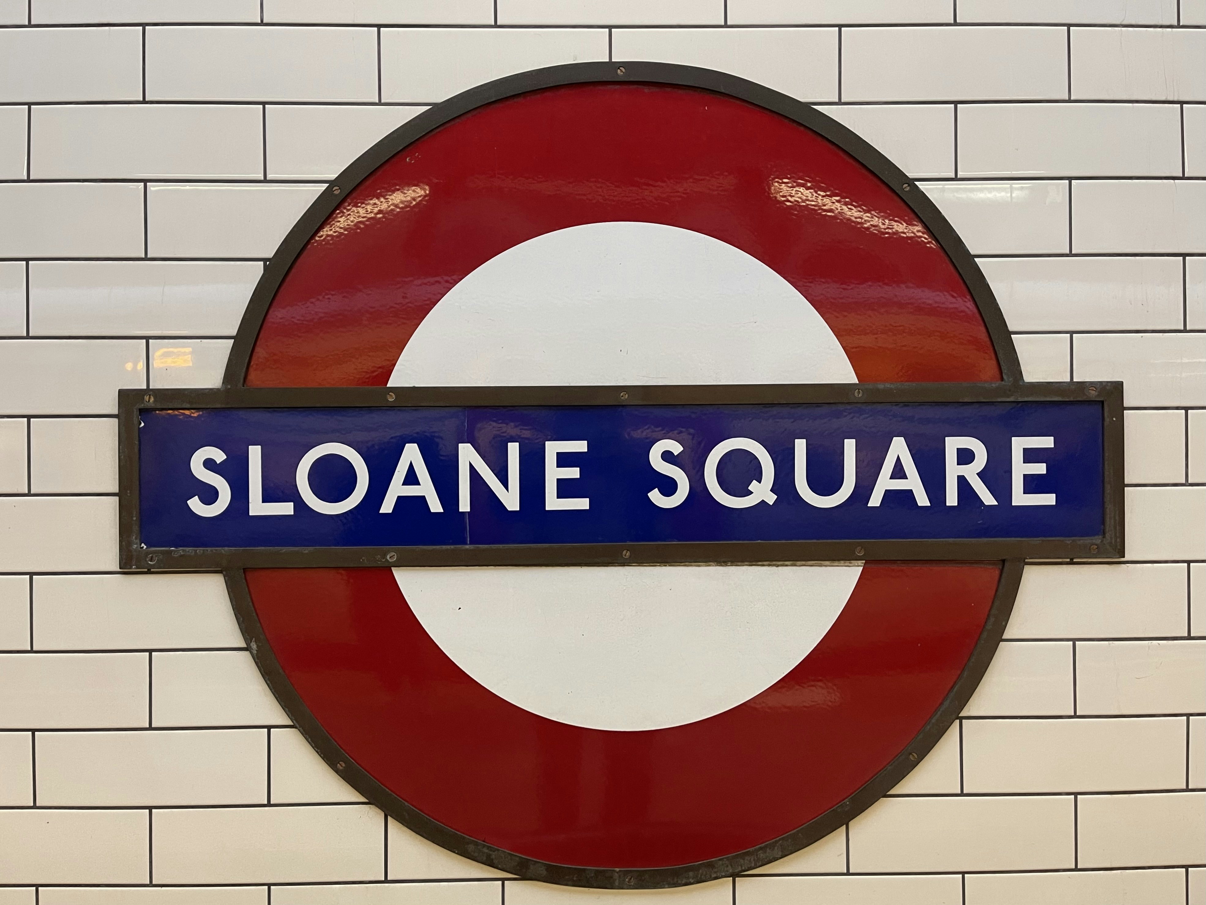 Sloane Square Roundel: London Underground Emblem Framed by Cream Tiles