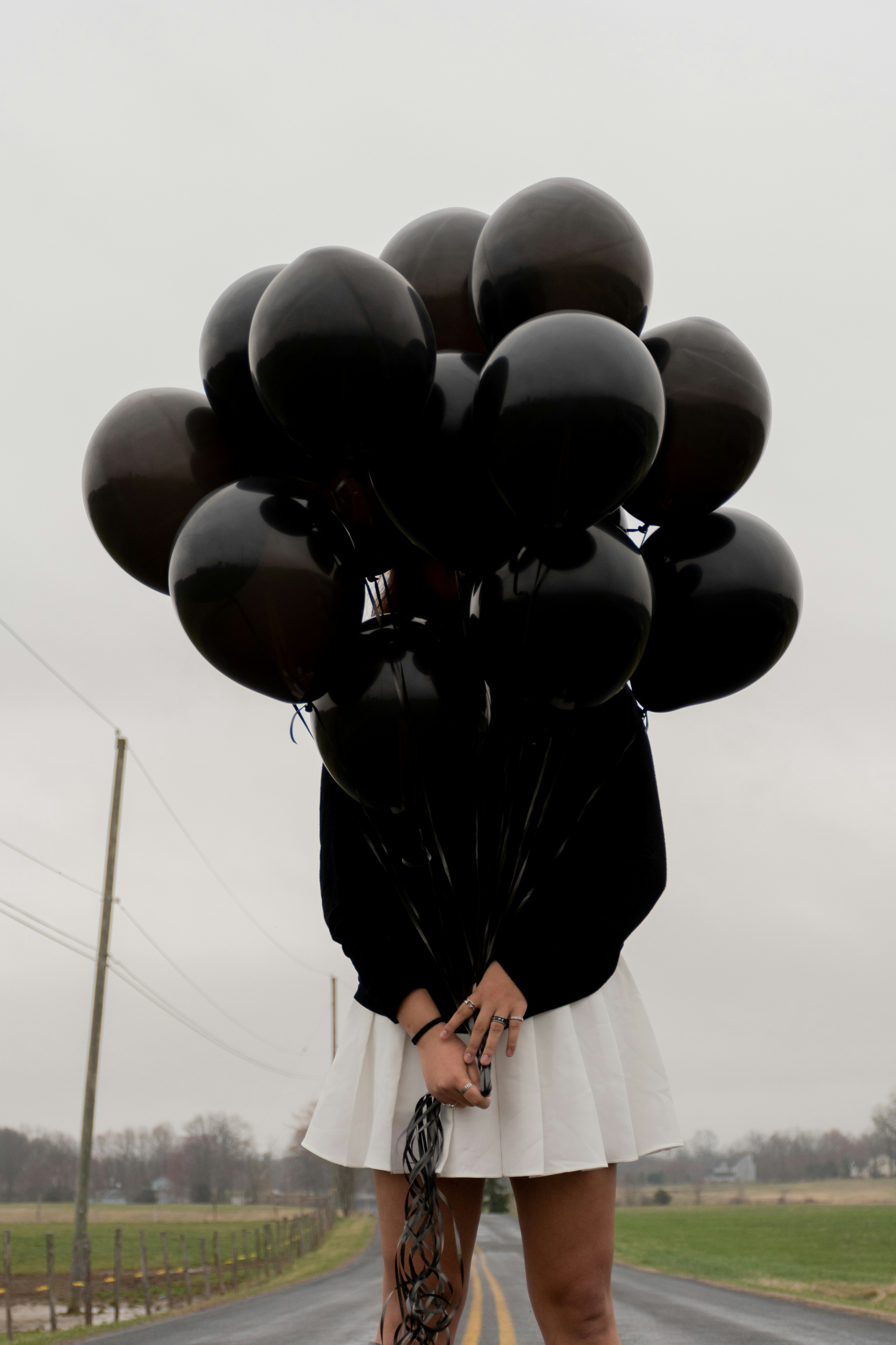 Balloon Bouquet Cloaks a Quiet Country Road Portrait
