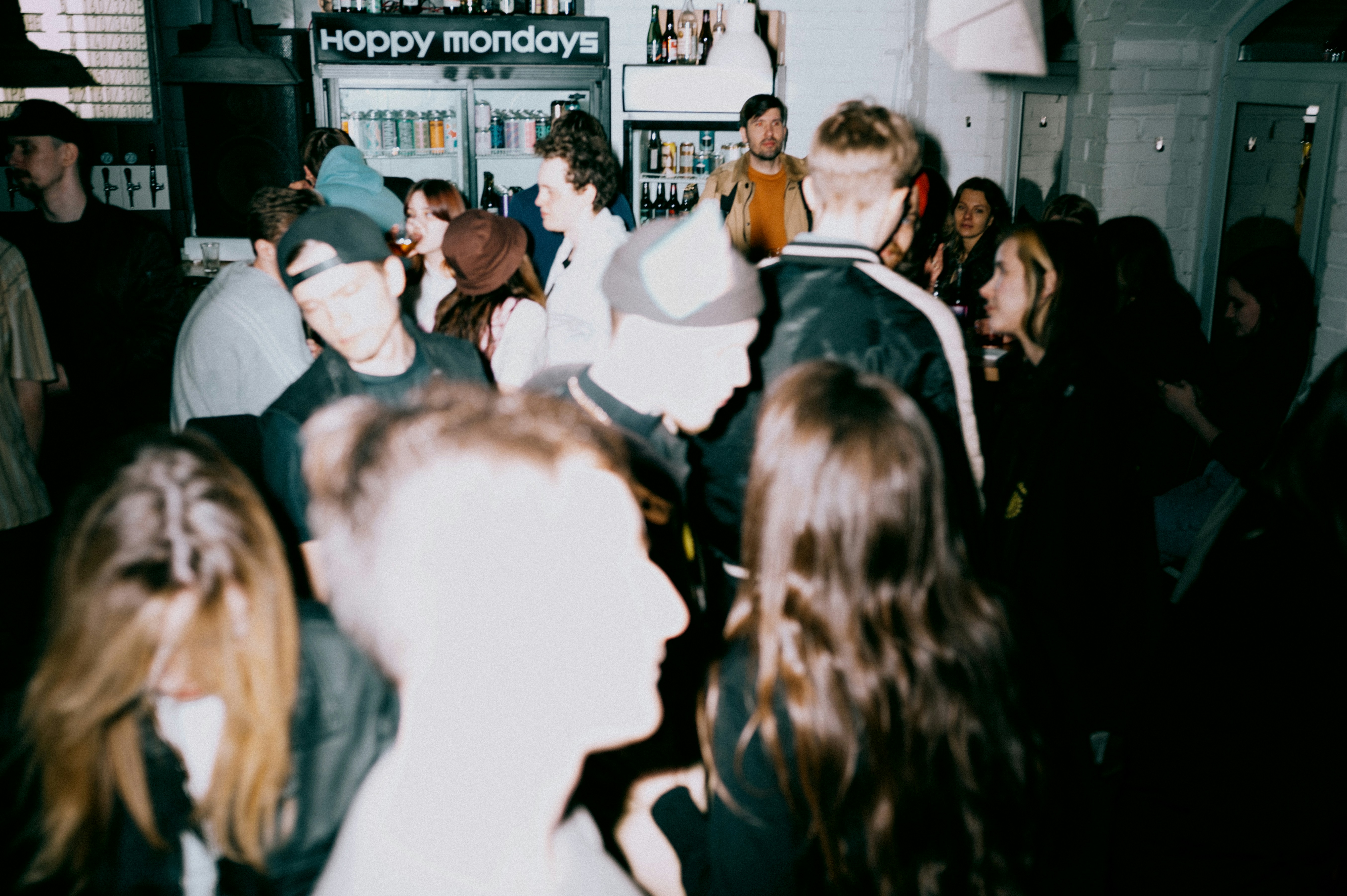 Hoppy Mondays Night: Faces in a Neon-Hazed Club Crowd