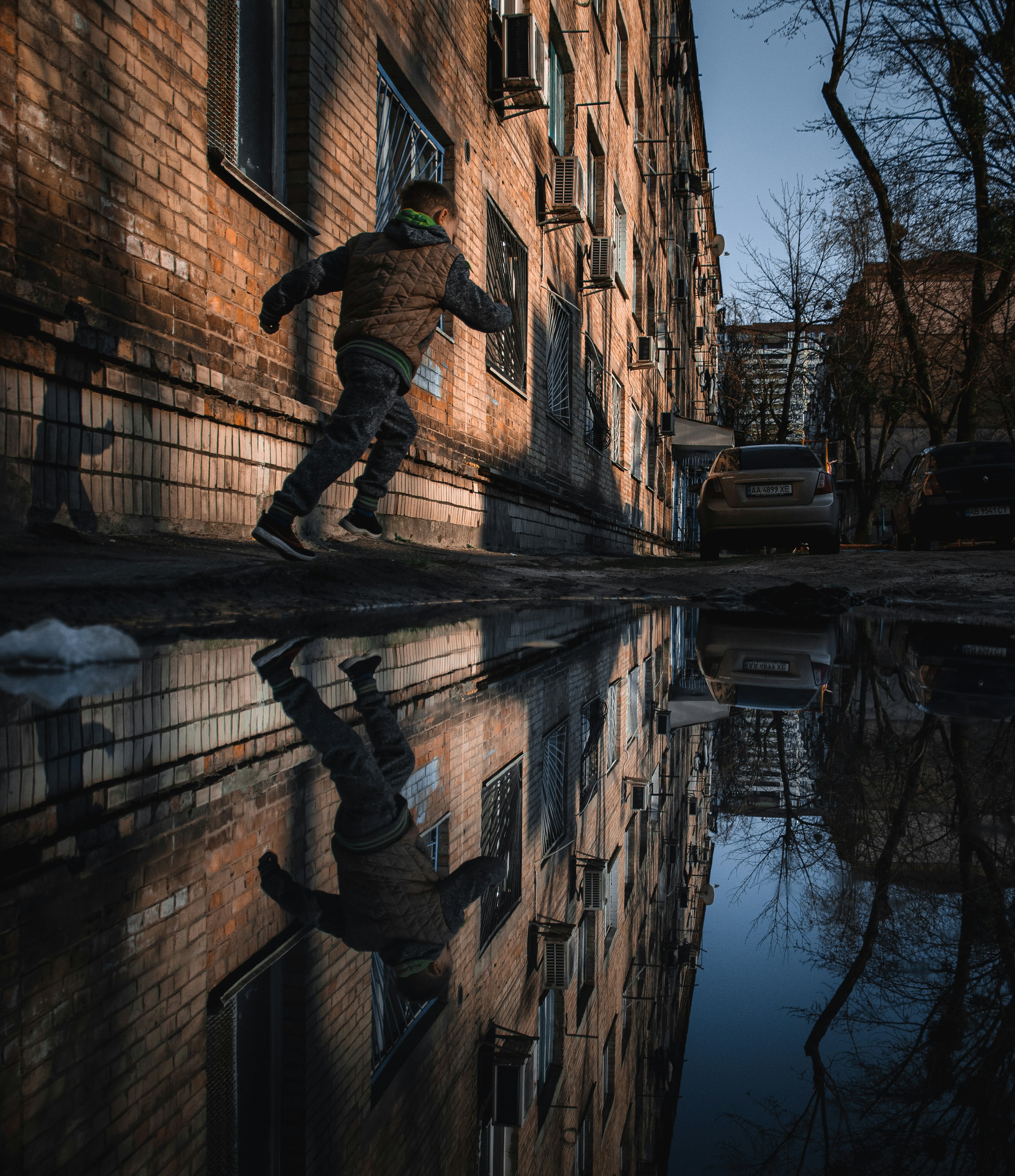 Runaway Echoes: A Silhouette Leaping Across a Brick Corridor