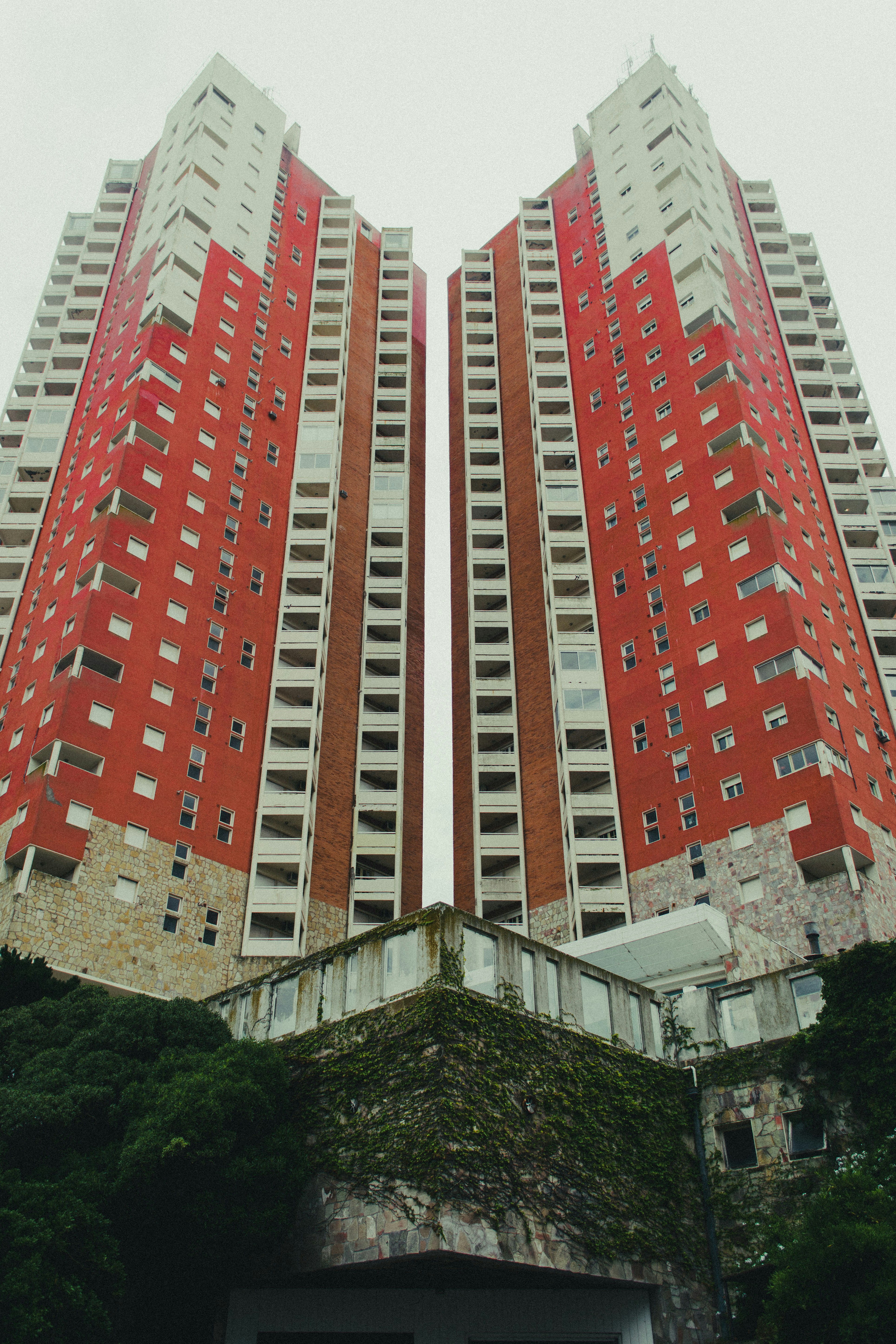 Crimson Convergence: Twin Towers Framing a Skyward Gap