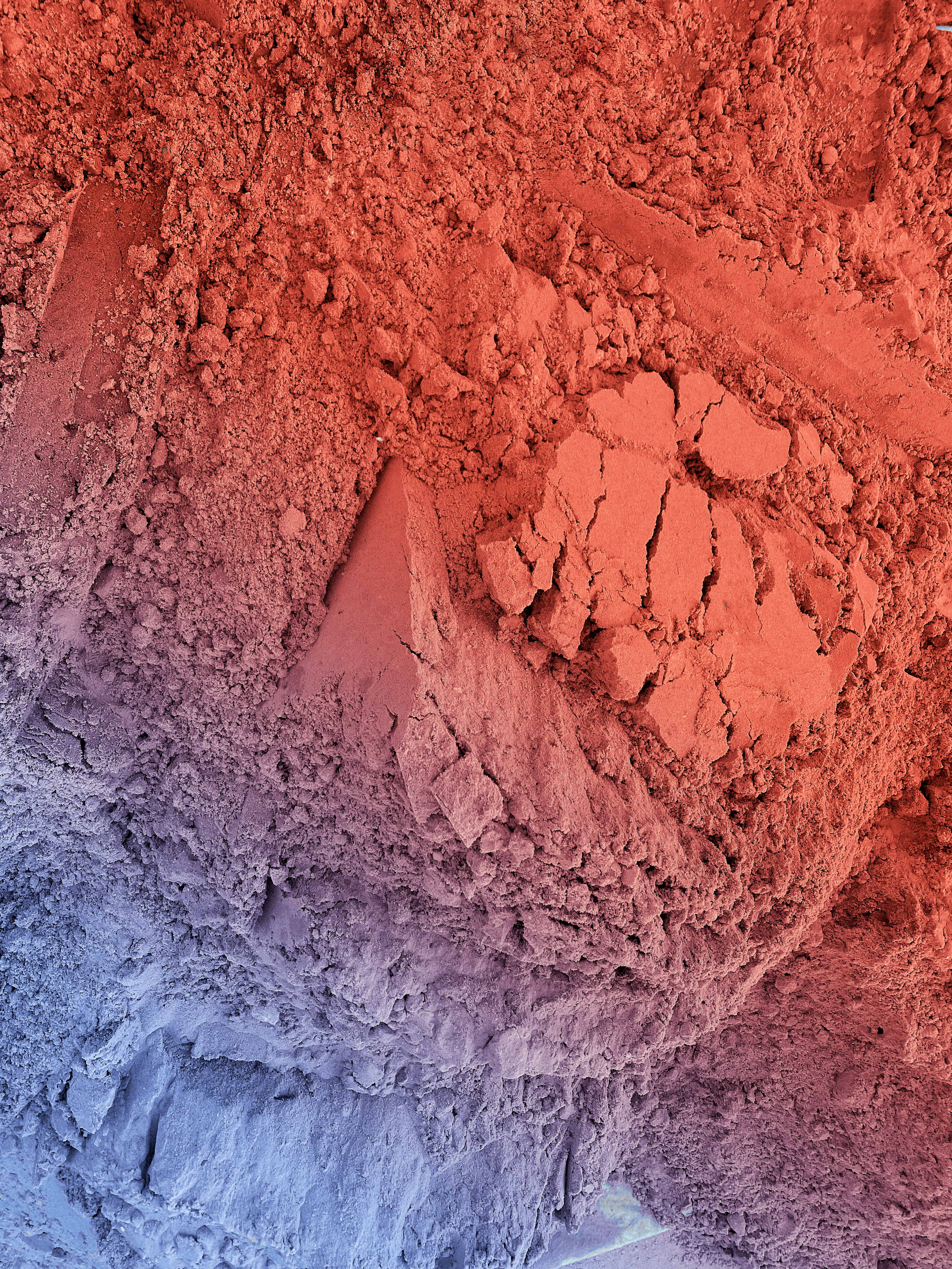Crimson Ridge and Indigo Dust: A Close-up Study of Textured Soil