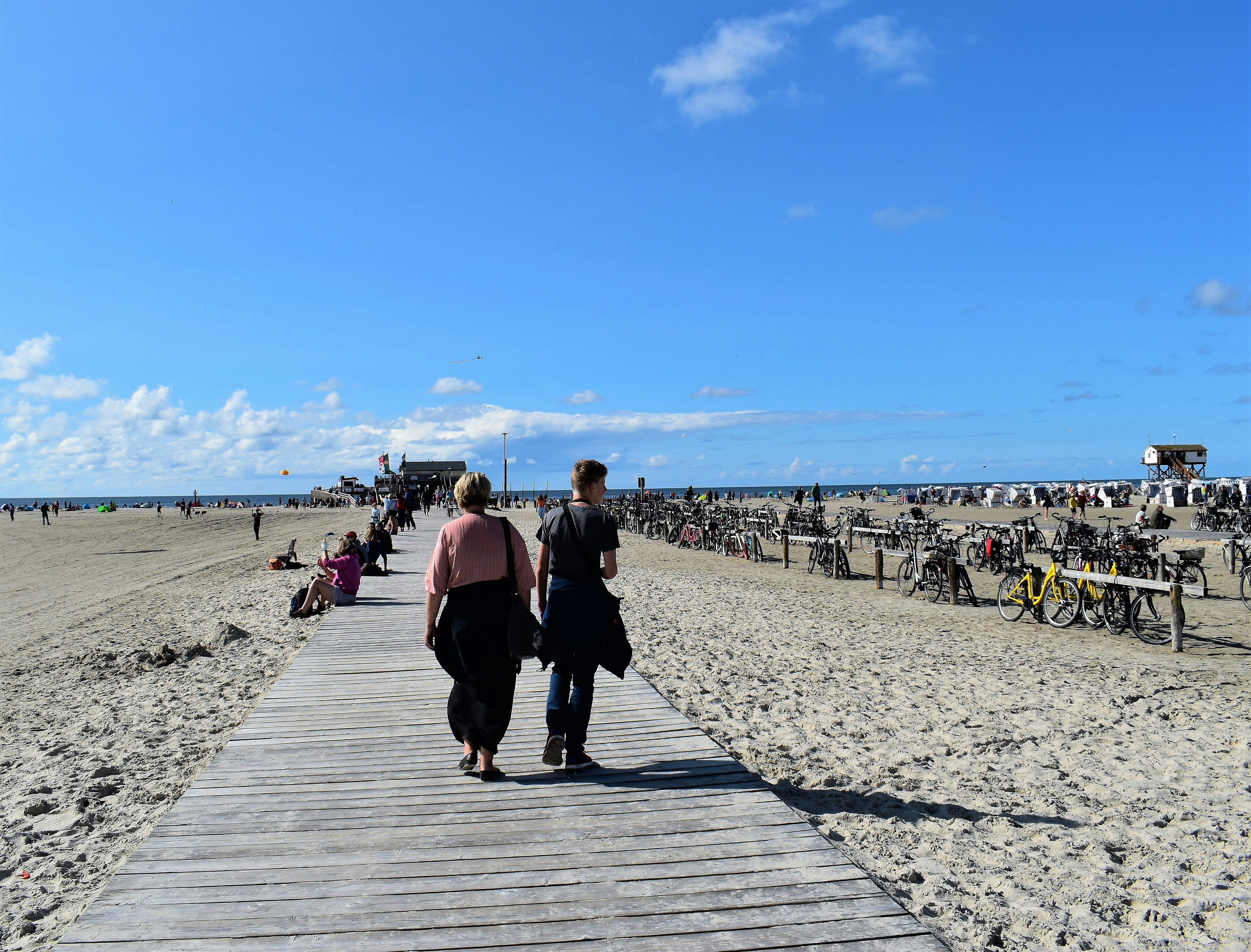 People walking on gray concrete pathway during daytime photo – Free ...