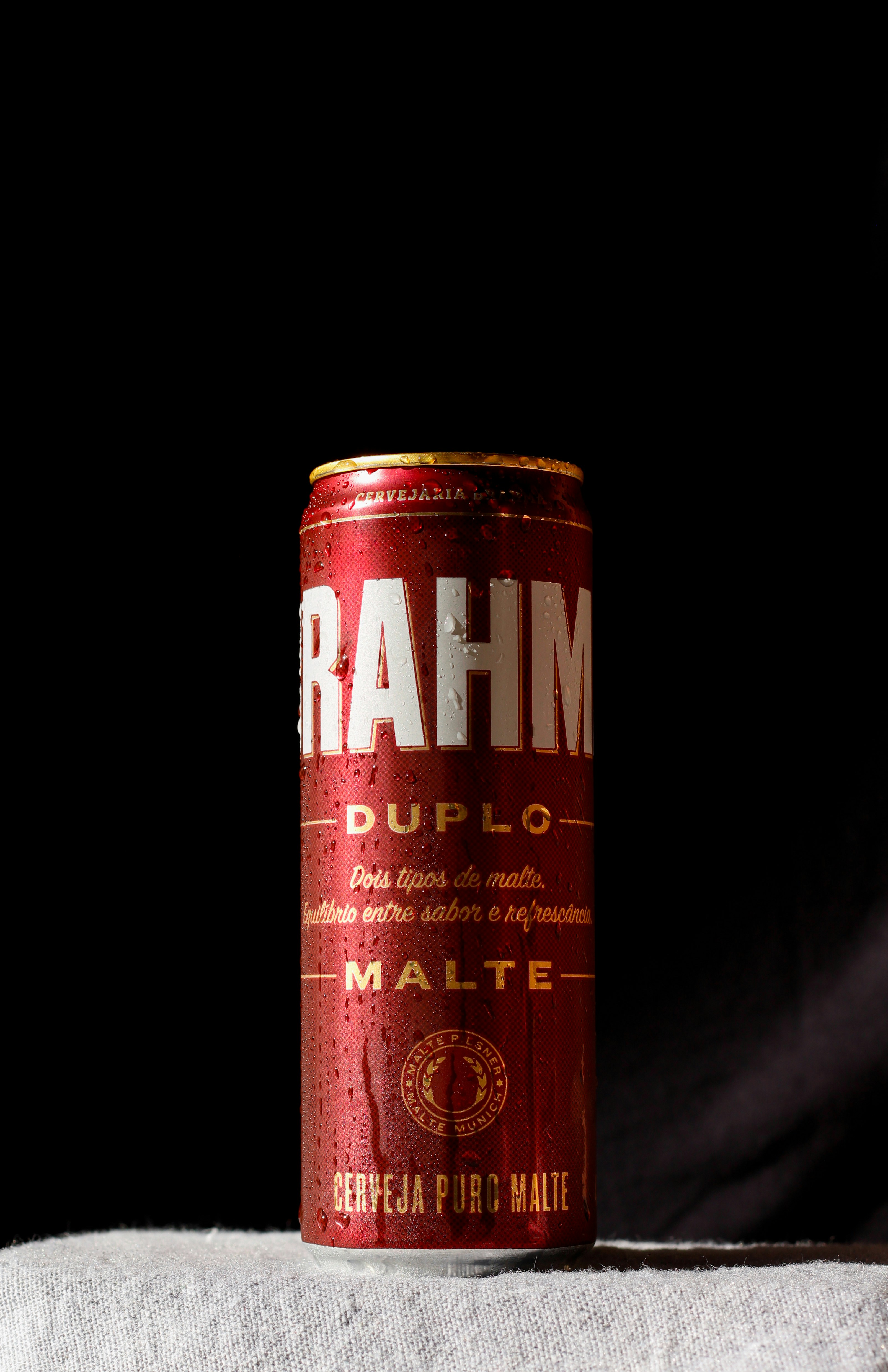 Red and white labeled can photo – Free Alcohol Image on Unsplash