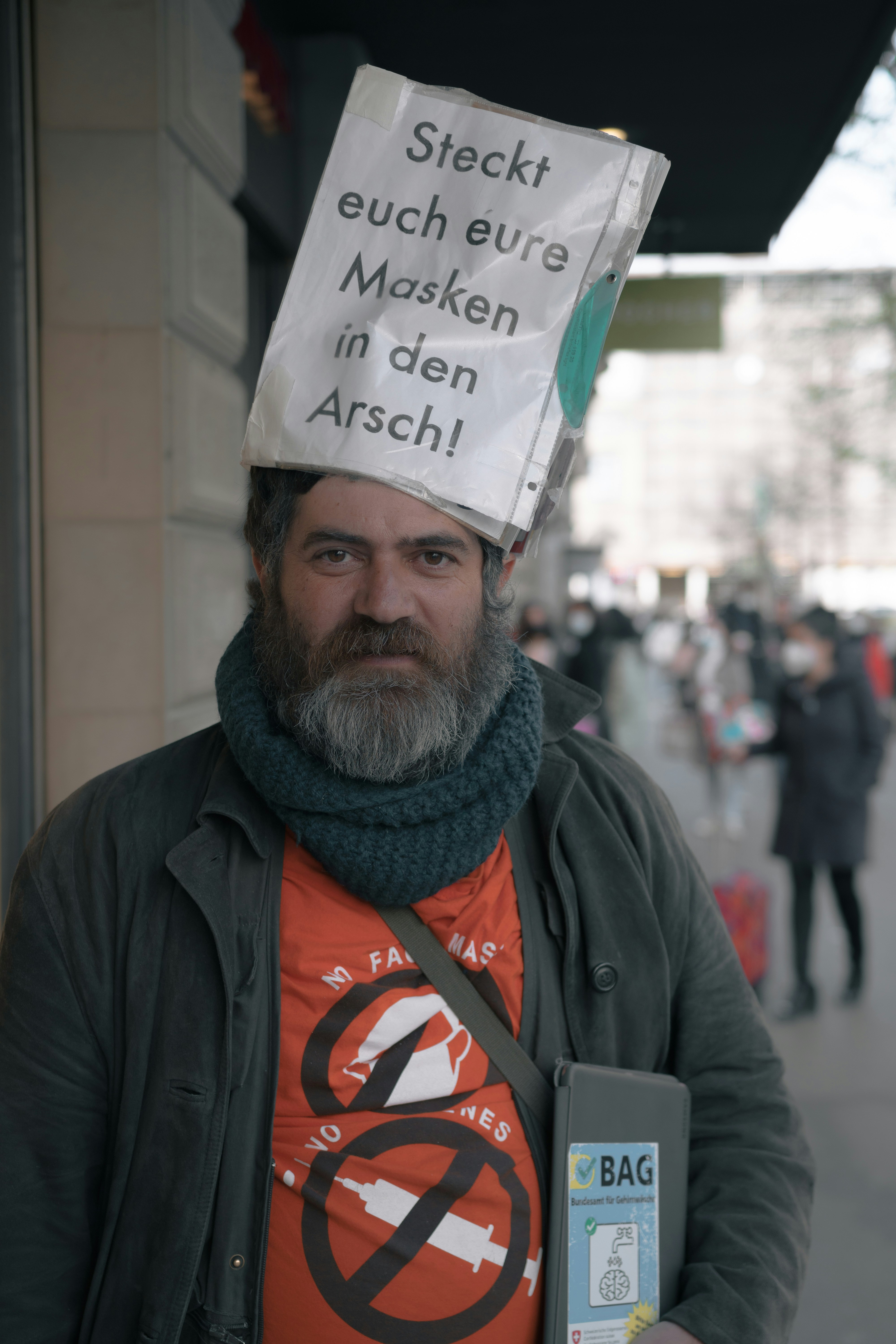Bearded Messenger under a Protest Sign