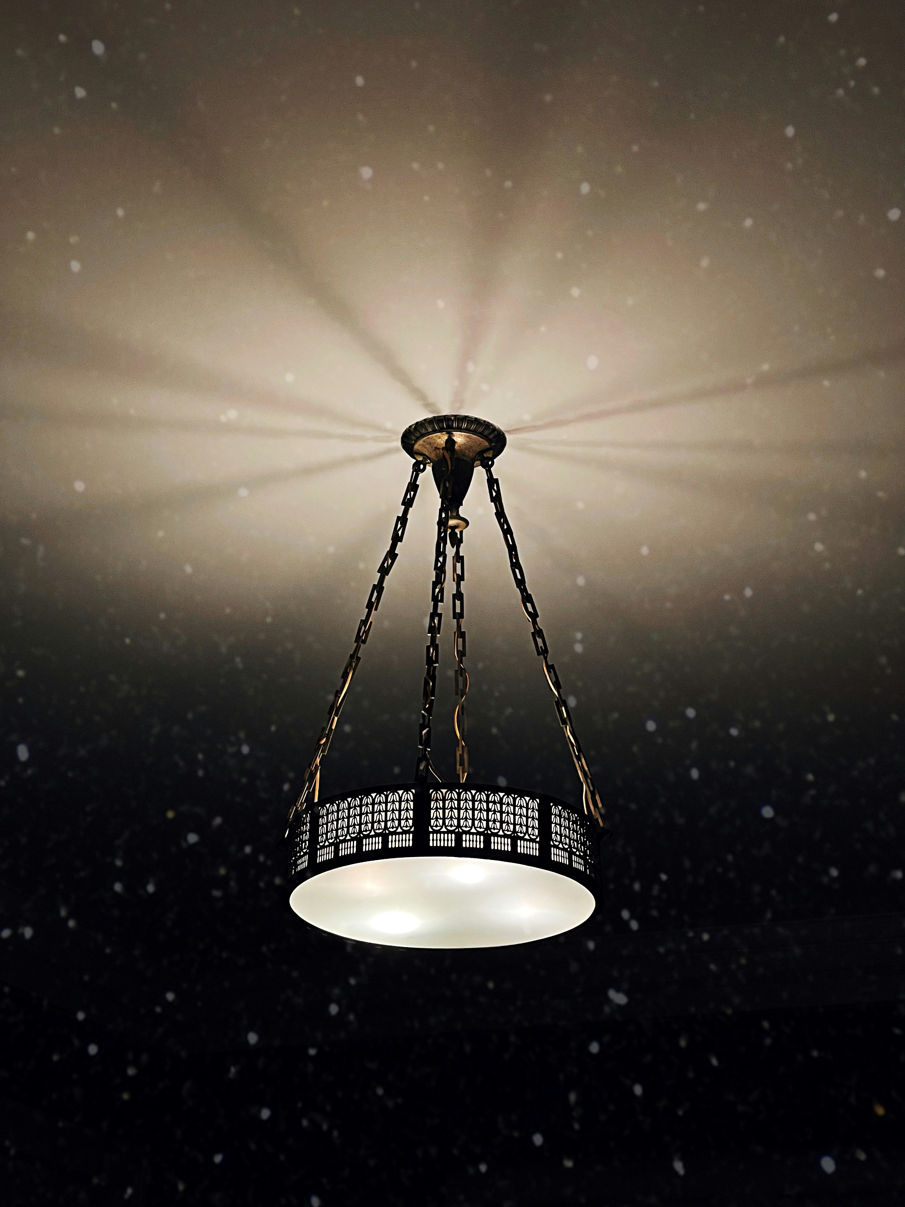 Haloed Pendant Lantern Suspended in a Snow-Dusted Midnight