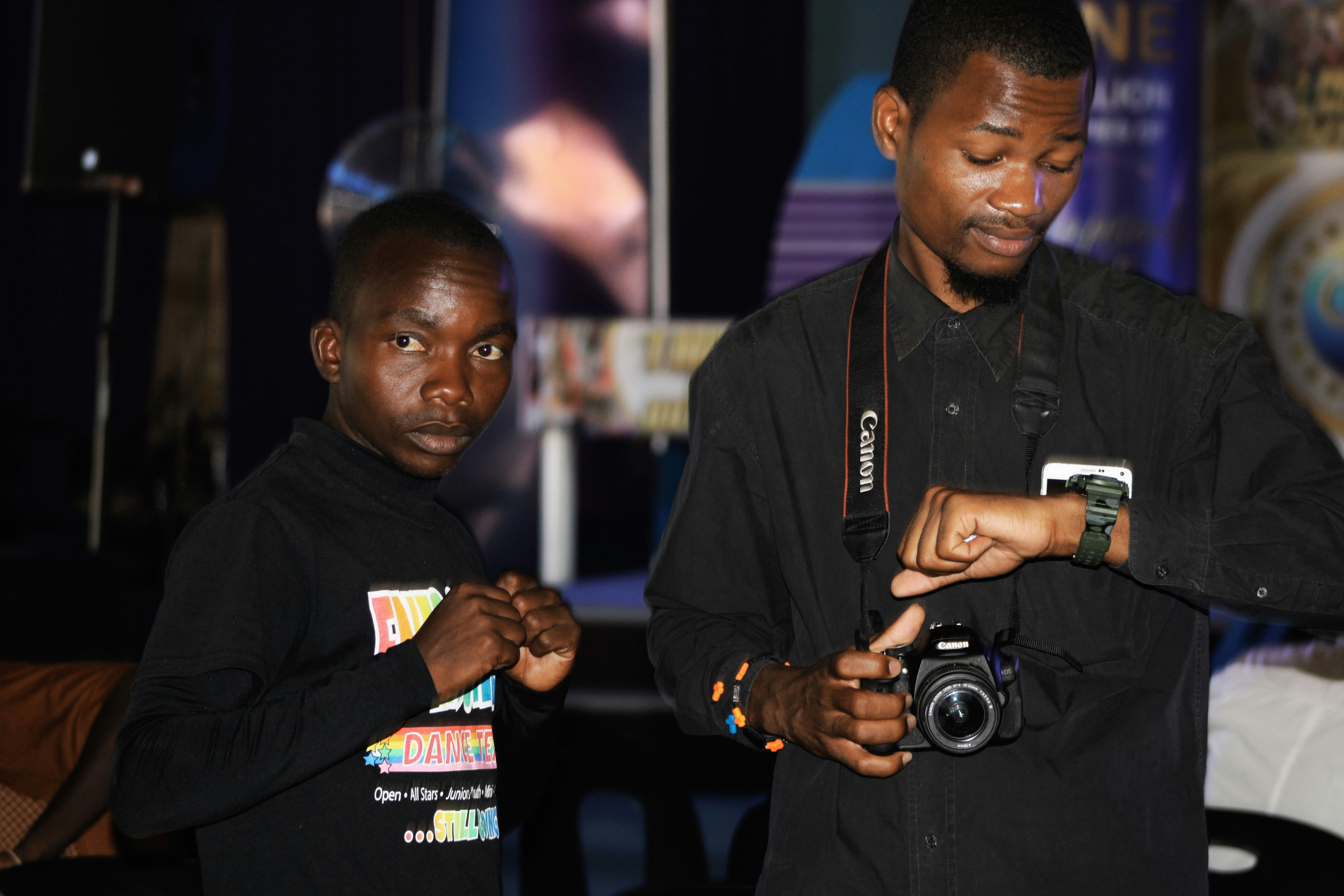 Man in black zip up jacket holding black dslr camera photo – Free Black ...