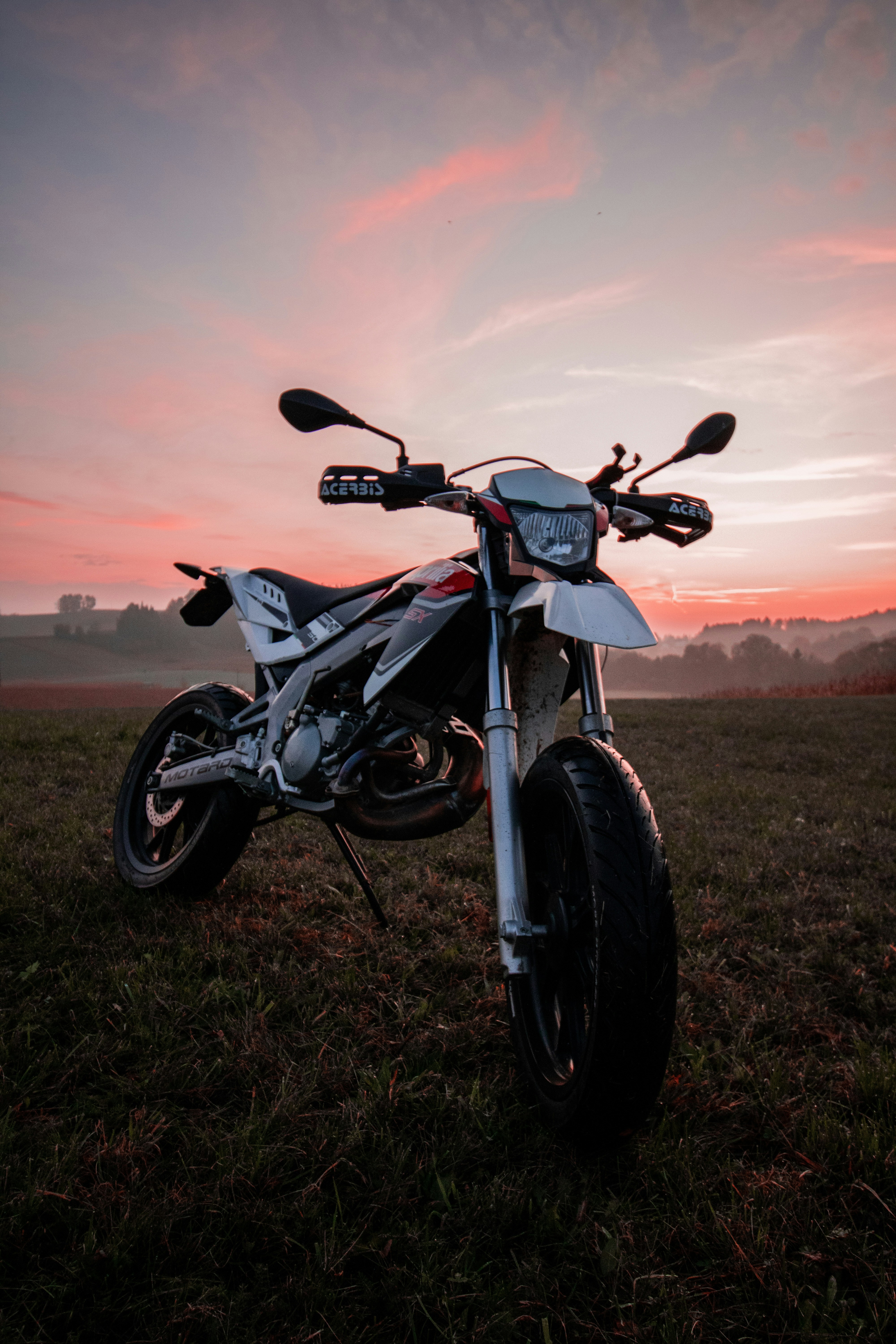 Black and gray motorcycle on green grass field during daytime photo ...