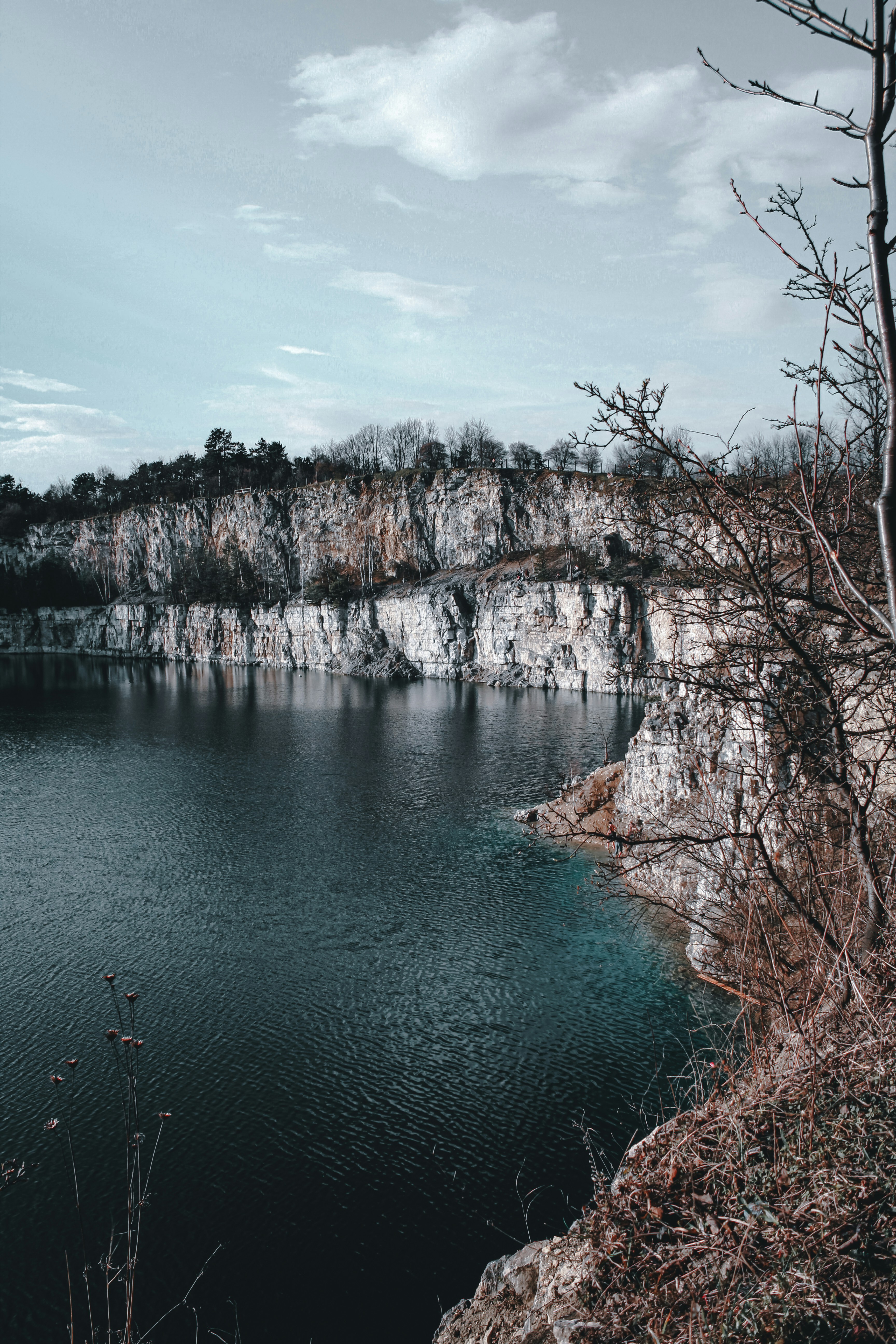 Limestone Curtain Over a Quiet Lake