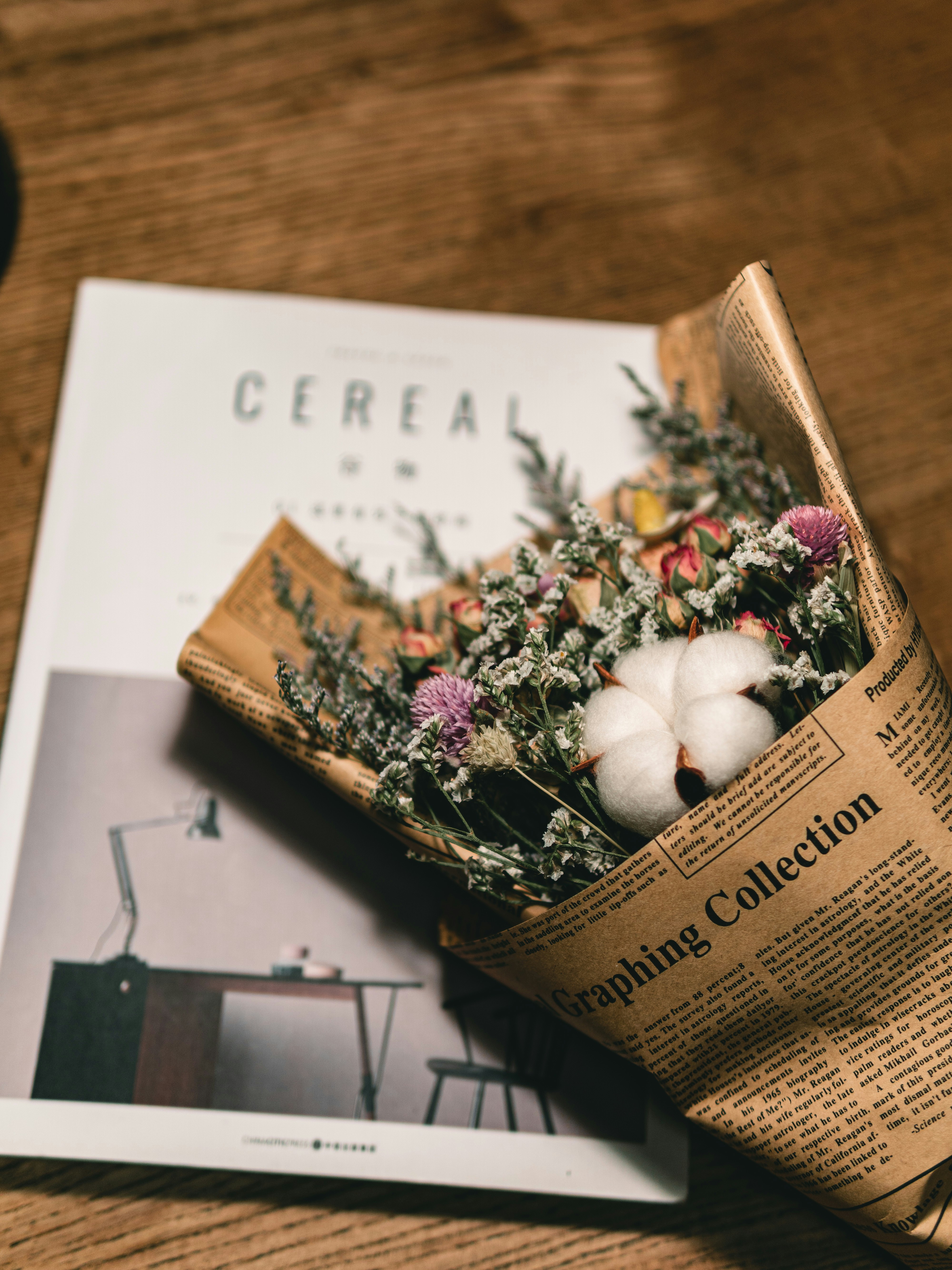 Floral Moment in Newsprint: Bouquet Resting on a Minimal Magazine Spread