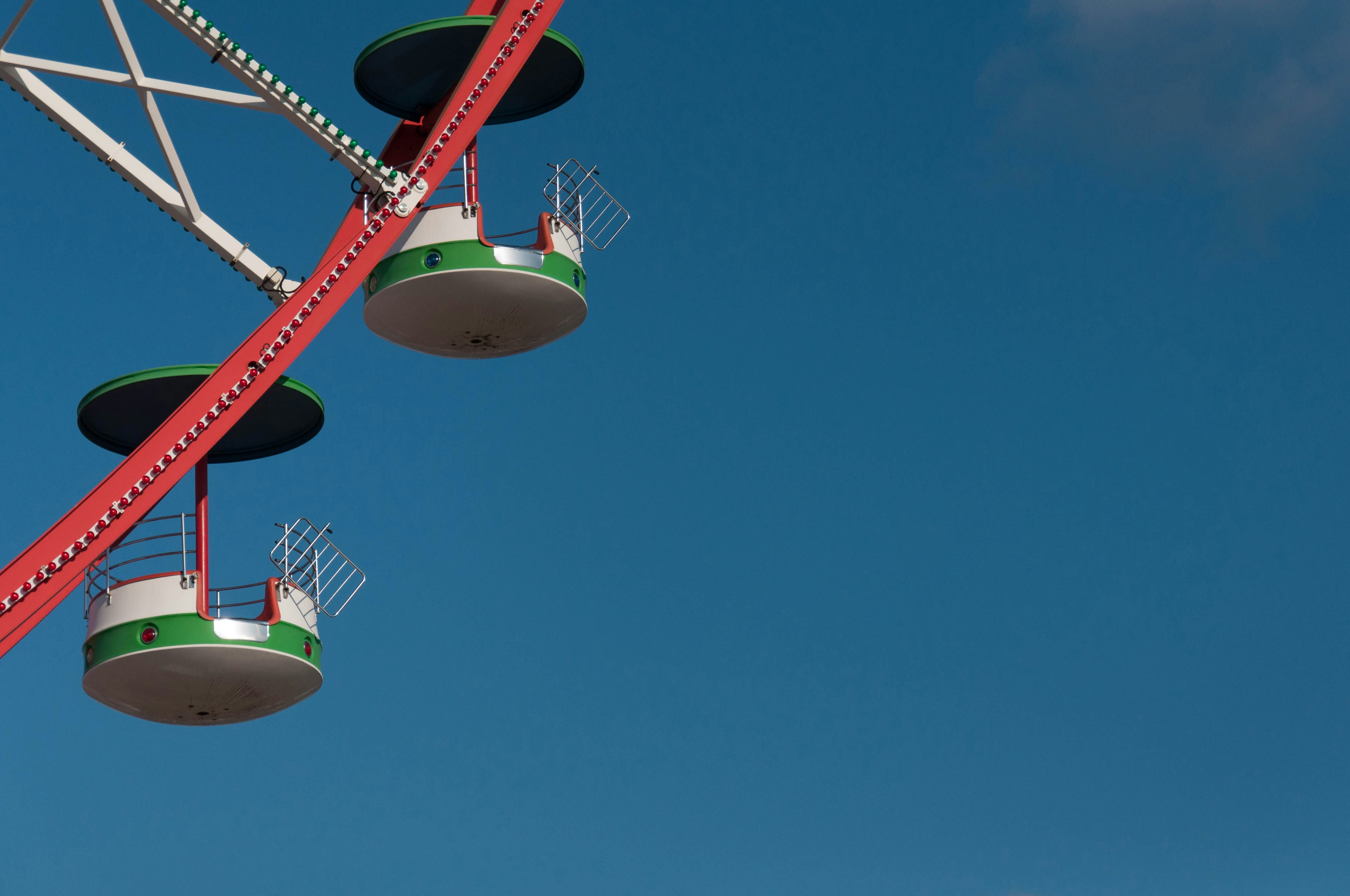 Blue Sky Rides: A Tilted Ferris Wheel Against a Clear Day
