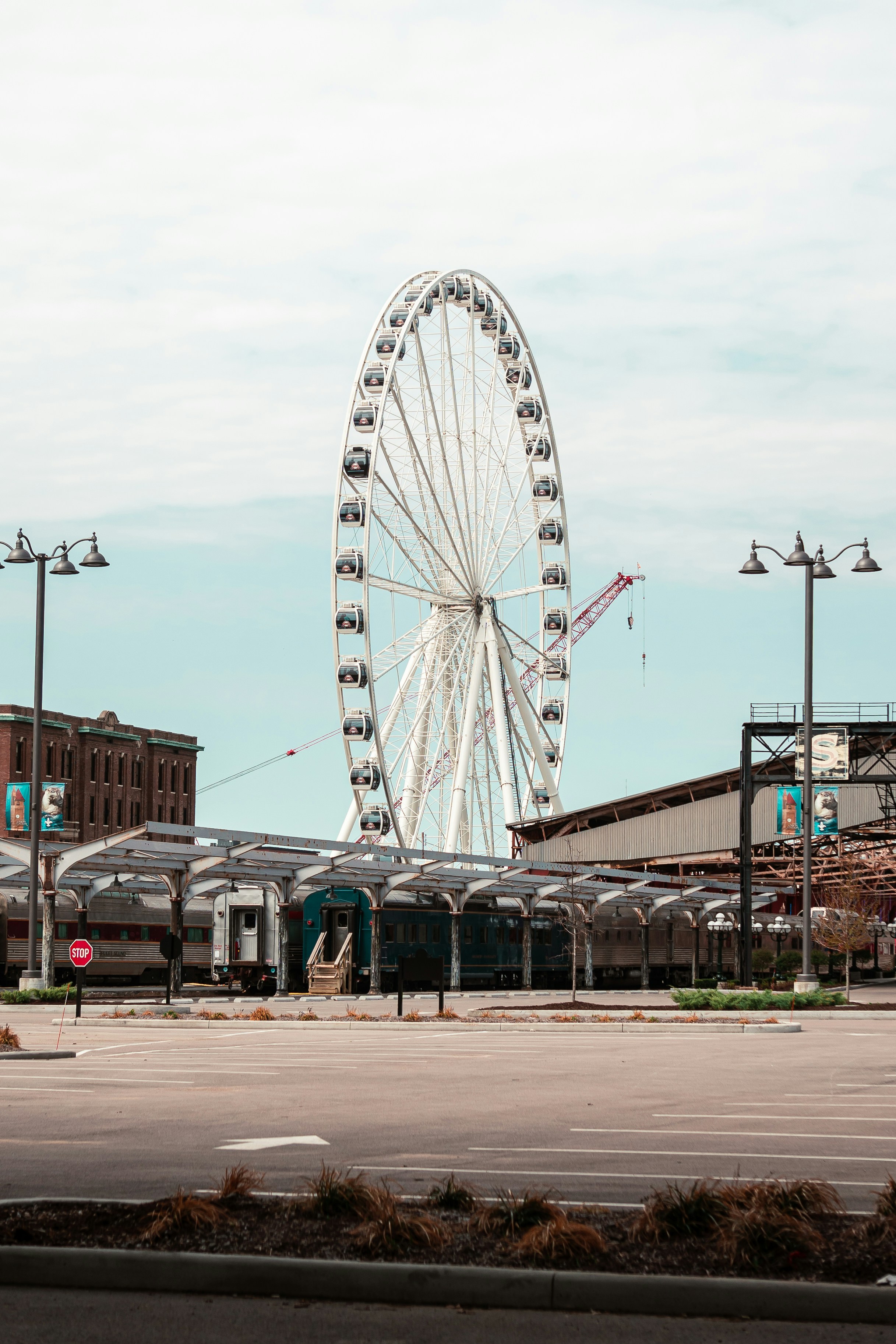 Urban Ferris Wheel Over a Quiet Transit Hub