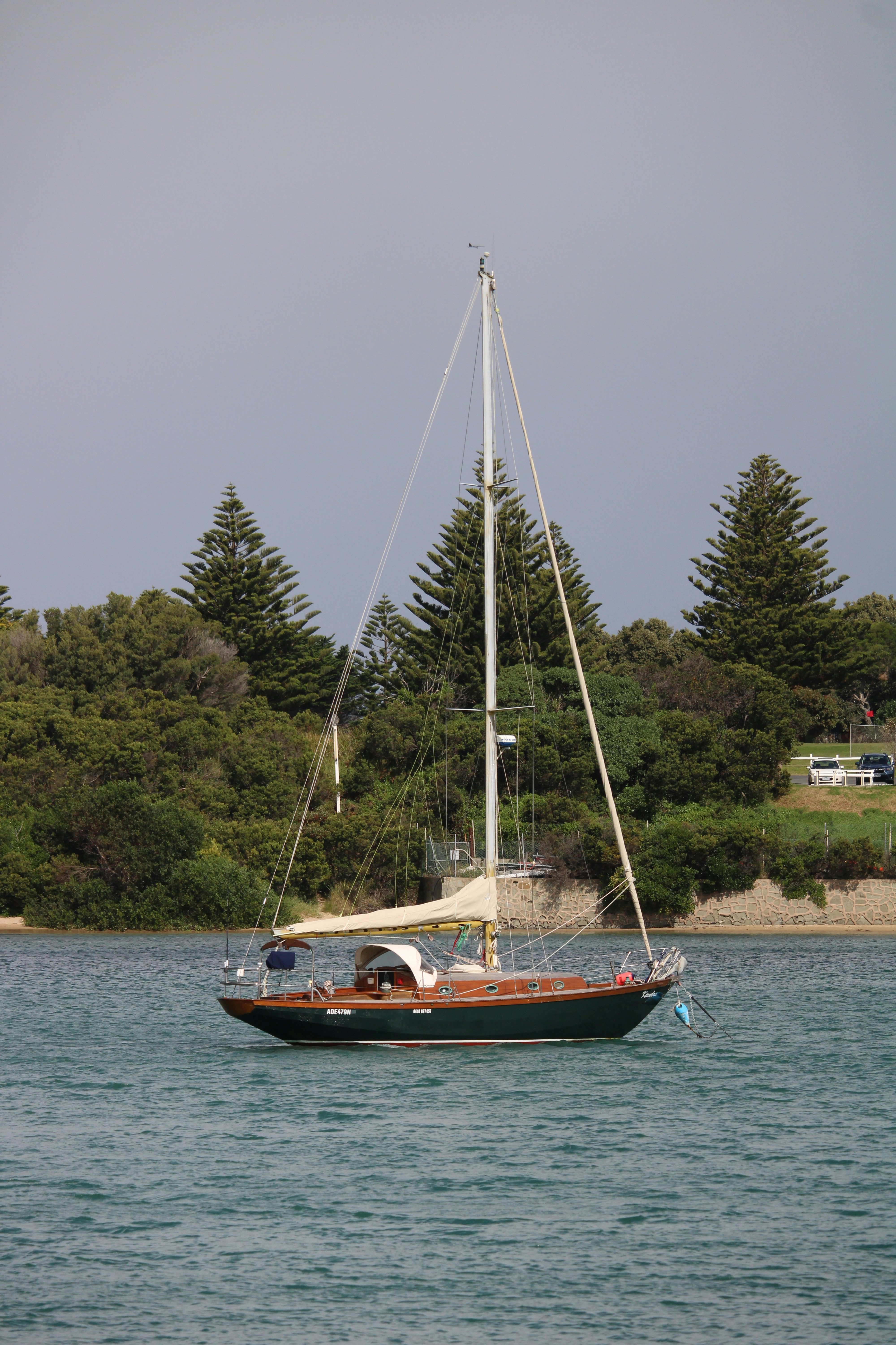 Sailing Quiet: A Lone Yacht Draped in Sea and Sky