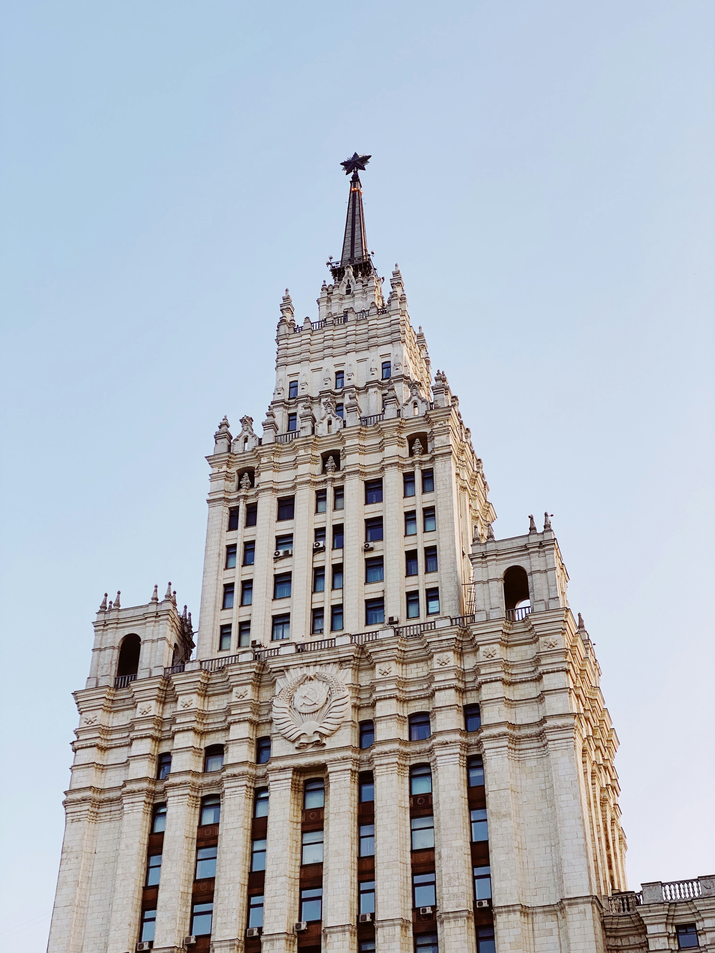 Beige concrete building under white sky during daytime photo – Free ...