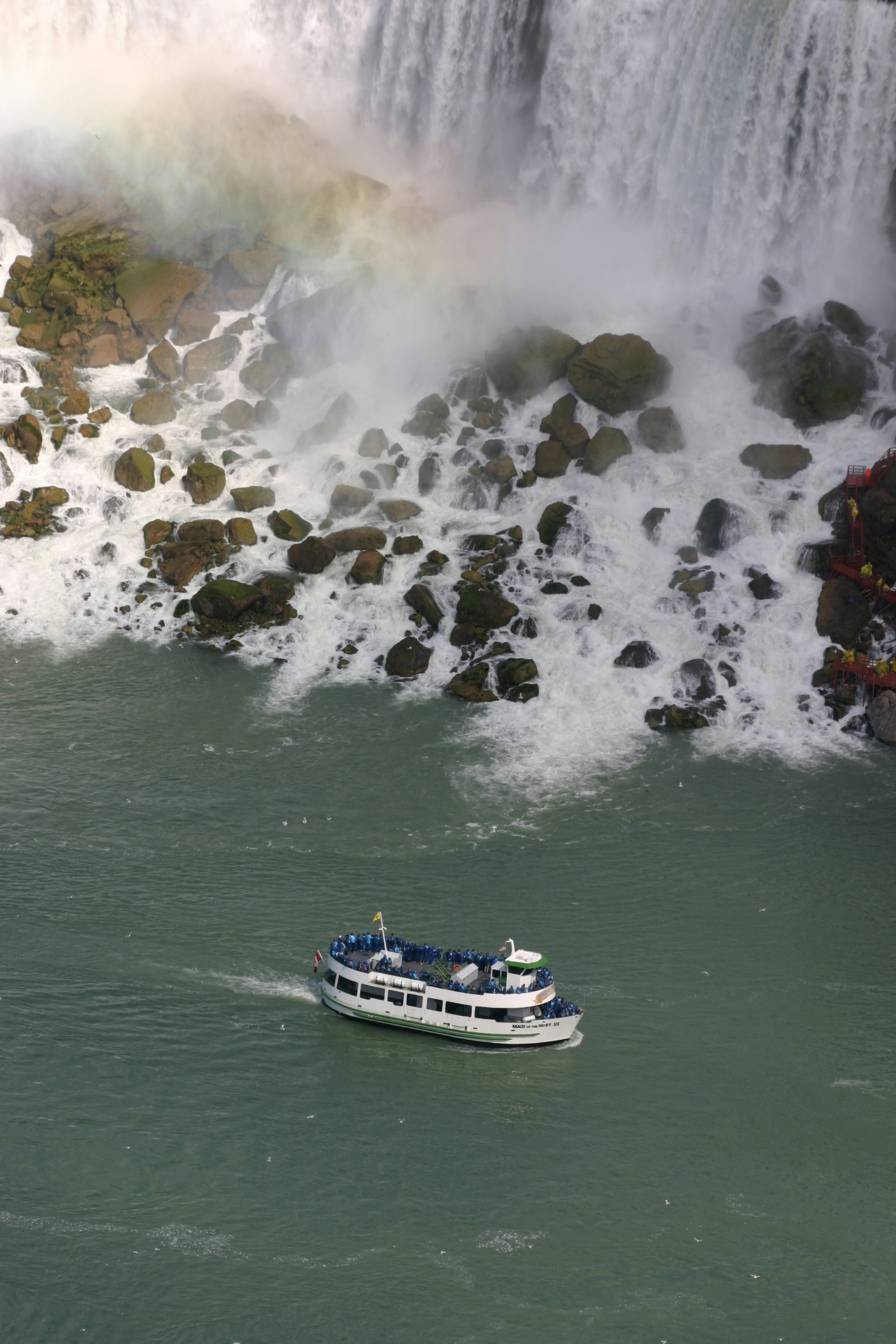 Rising Mist and a Quiet Voyager Beneath the Falls