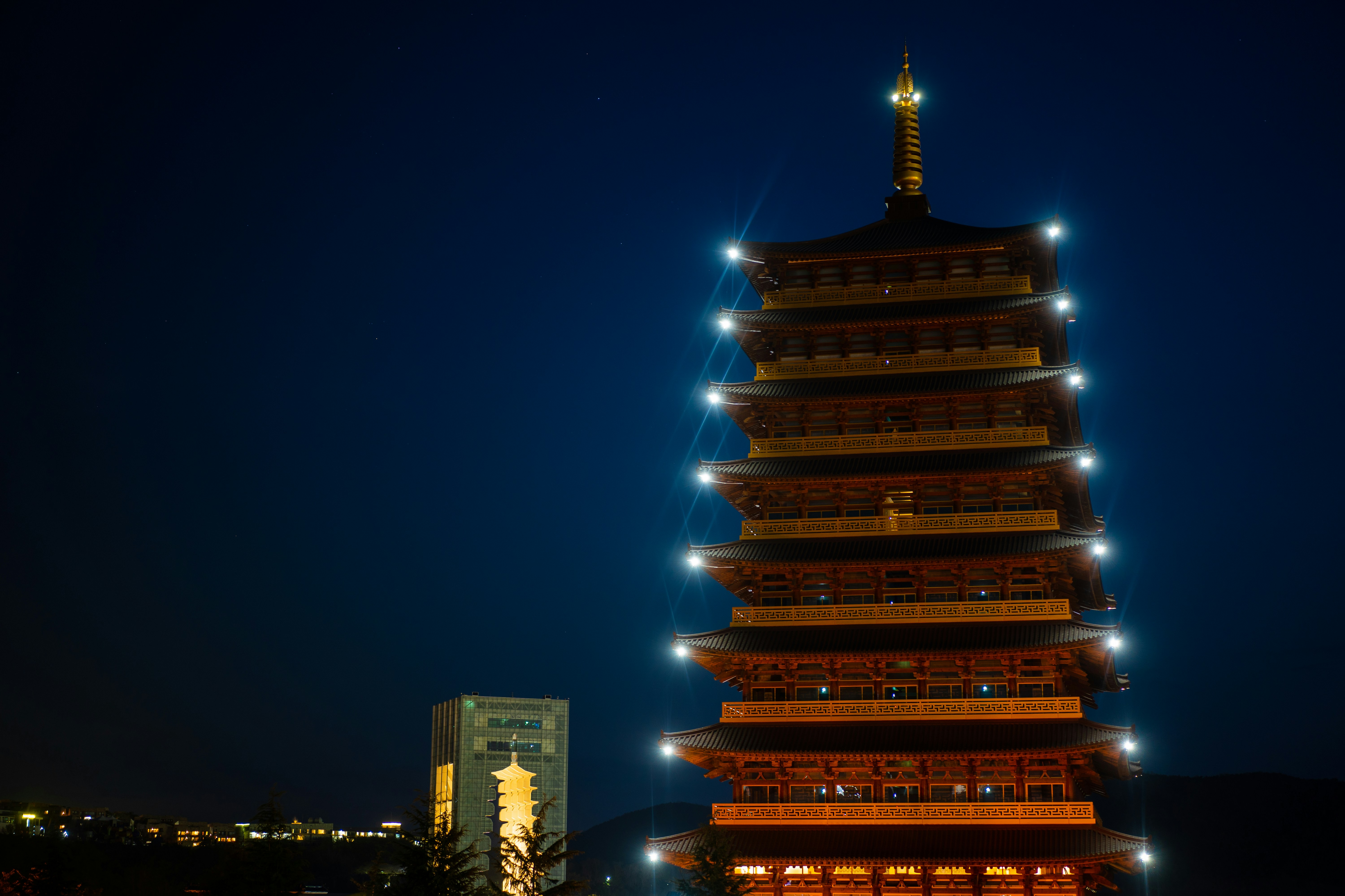 The Night-Illuminated Pagoda: A Tiered Beacon Over the City