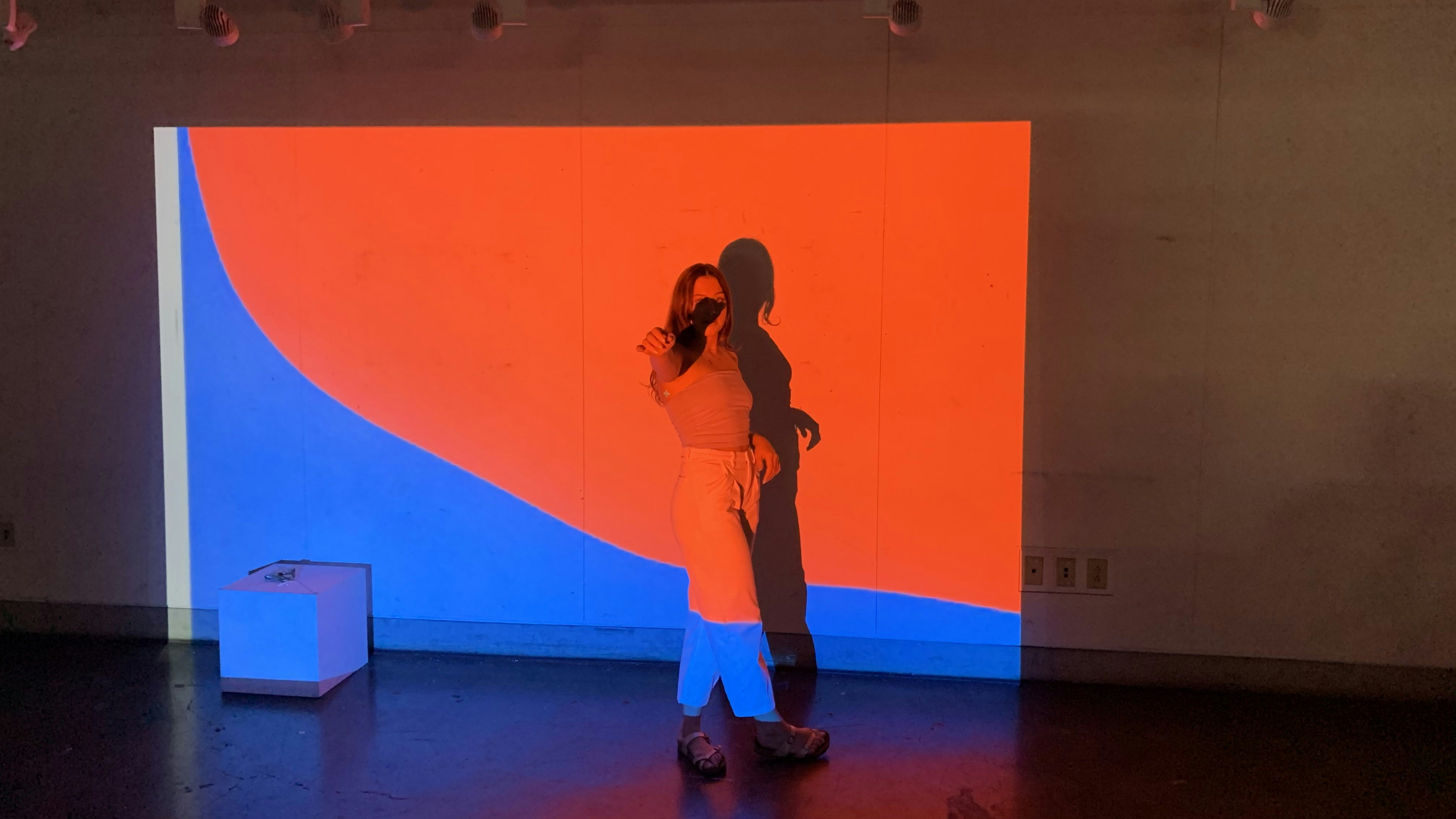 Self-Portrait Under a Split-Color Projection: Orange and Blue