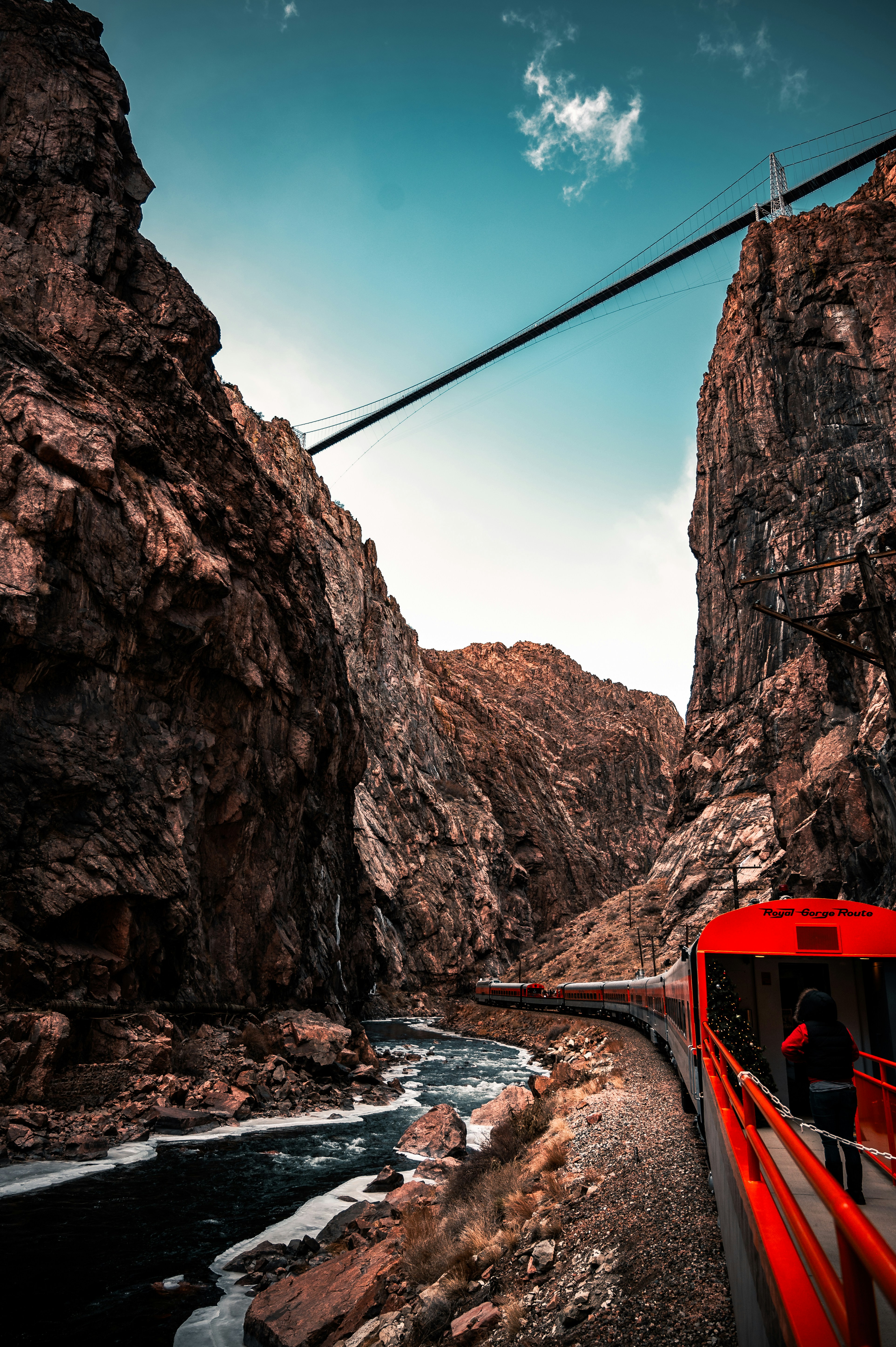 Ridge Crossing: A Red Car Navigates the Canyon Spine