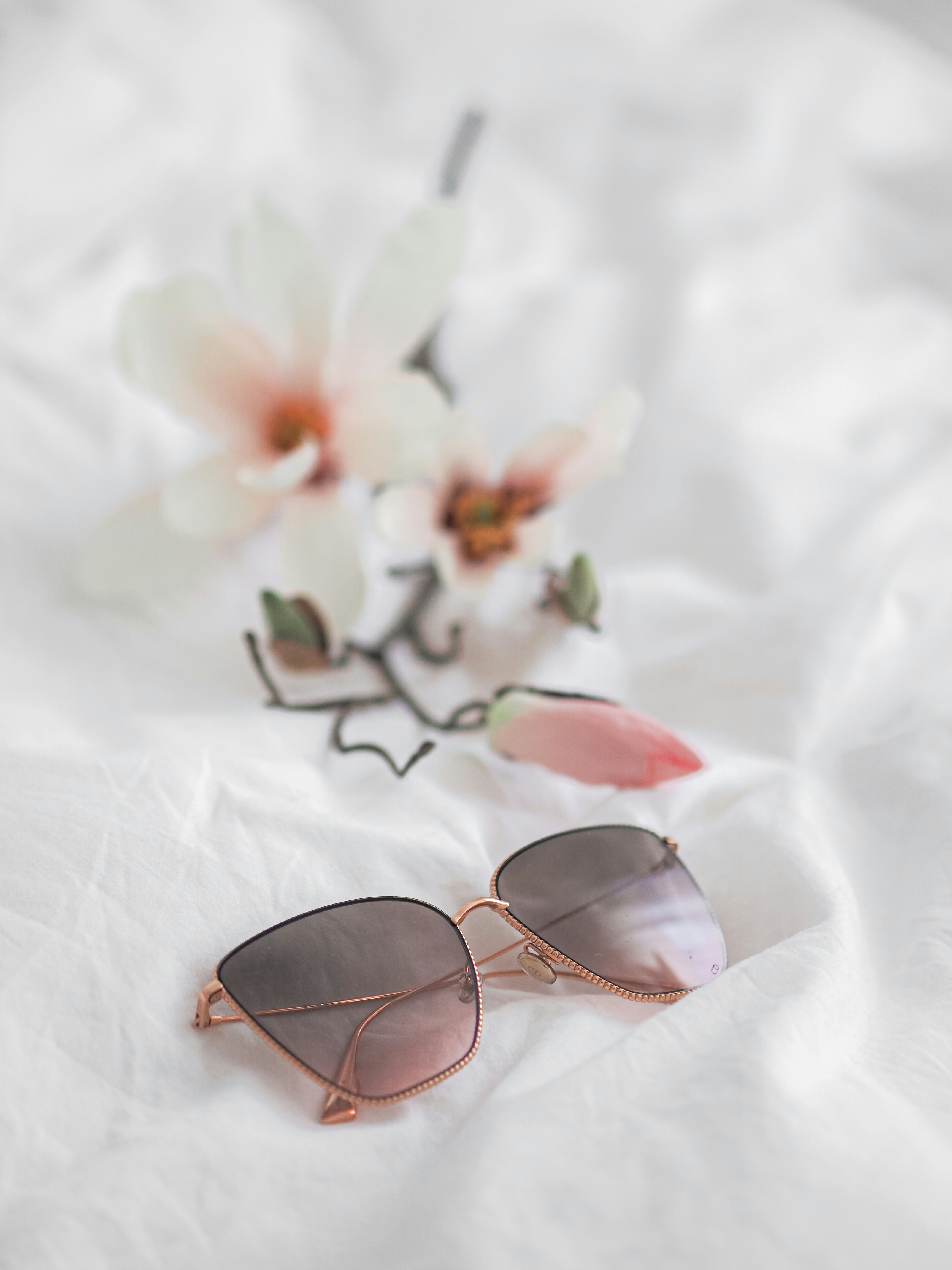 Gold framed aviator style sunglasses on white textile photo – Free ...