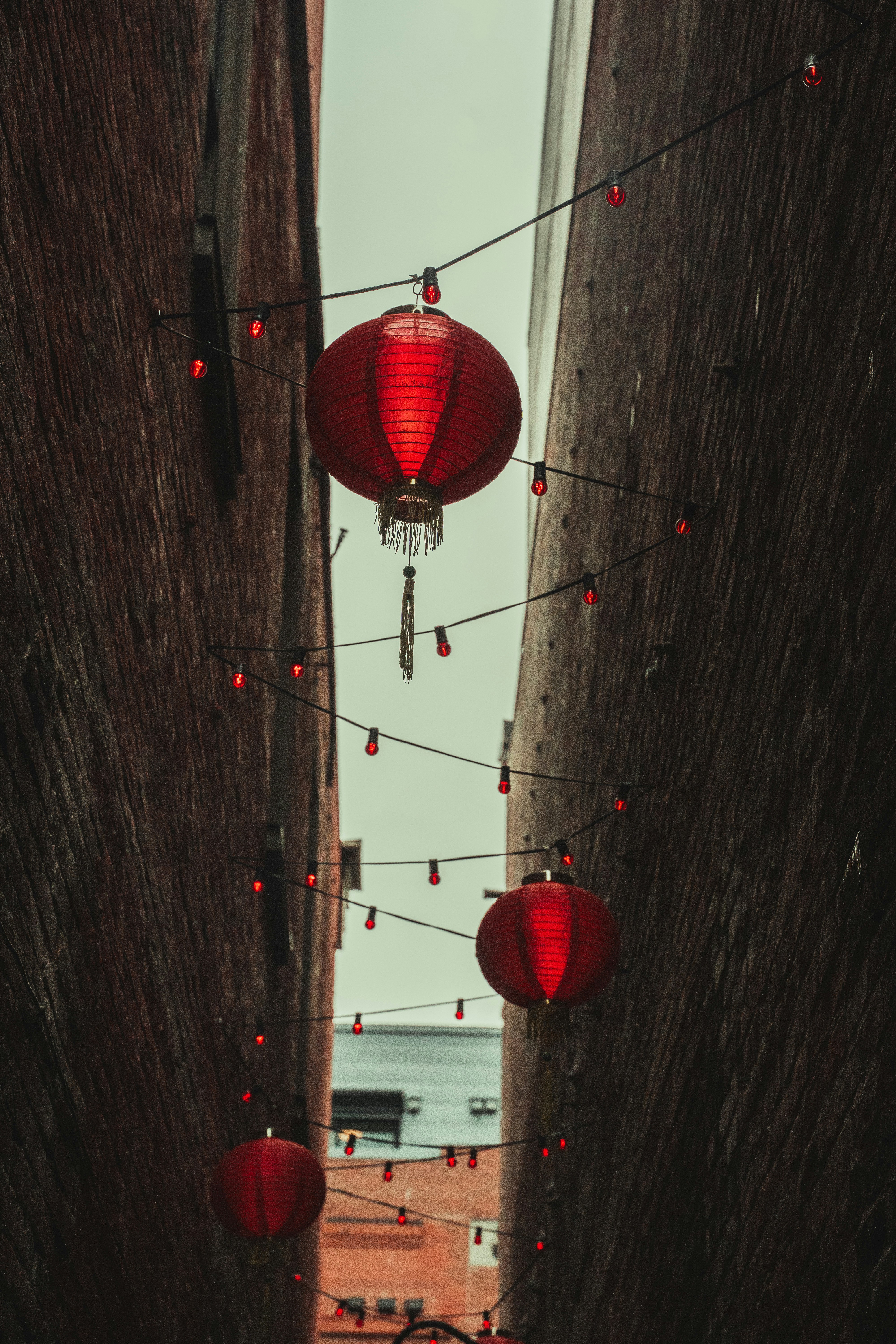 Red paper lantern on gray wooden wall photo – Free Canada Image on Unsplash