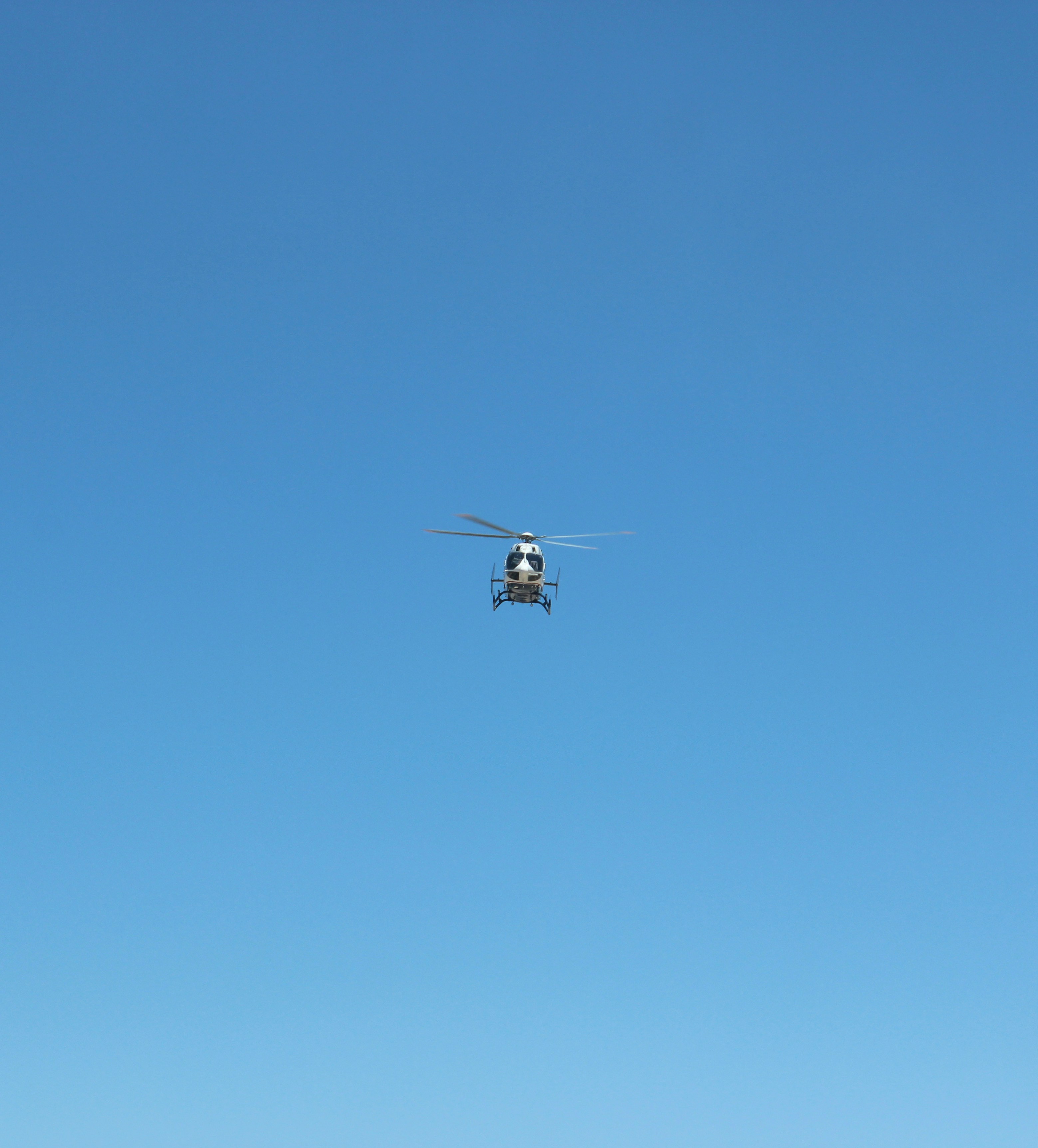 Skyward Rescue: A Helicopter Hover over Calm Blue