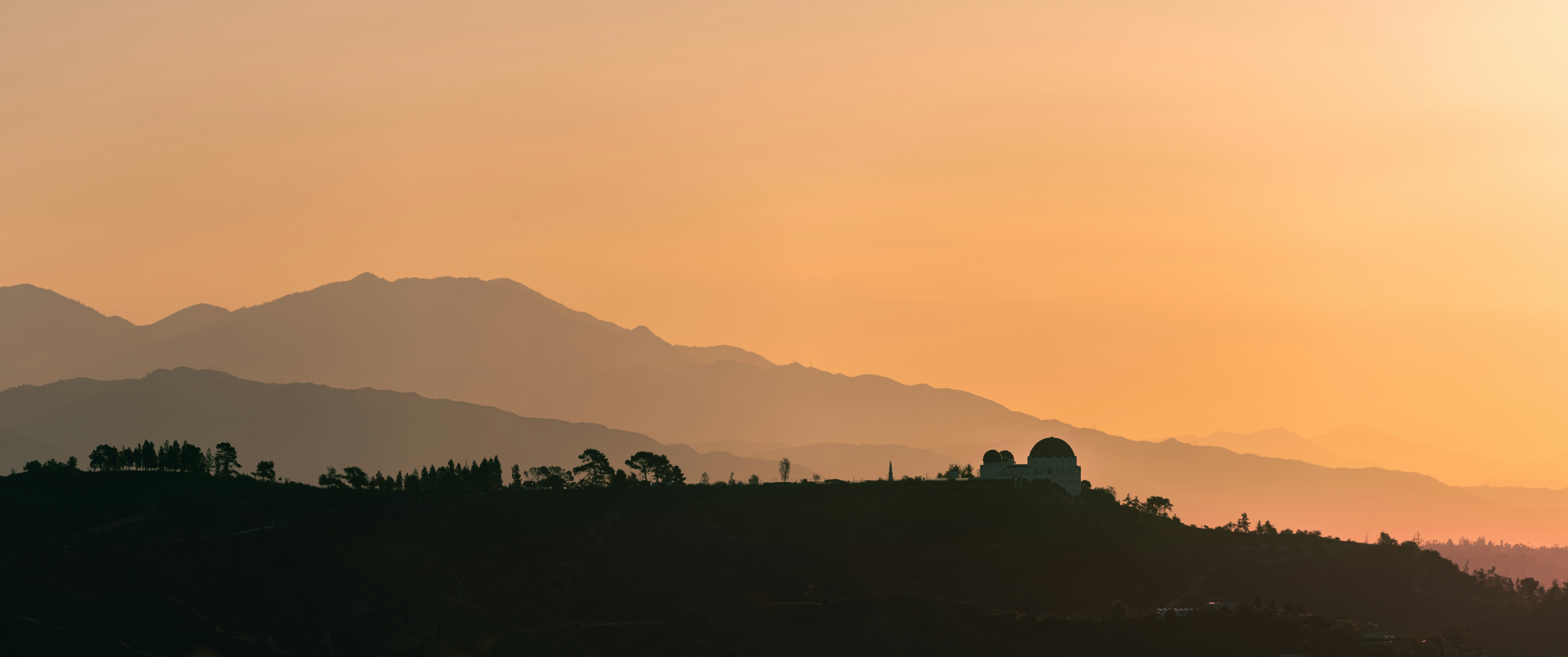 Silhouette of trees and mountains during sunset photo – Free Griffith ...