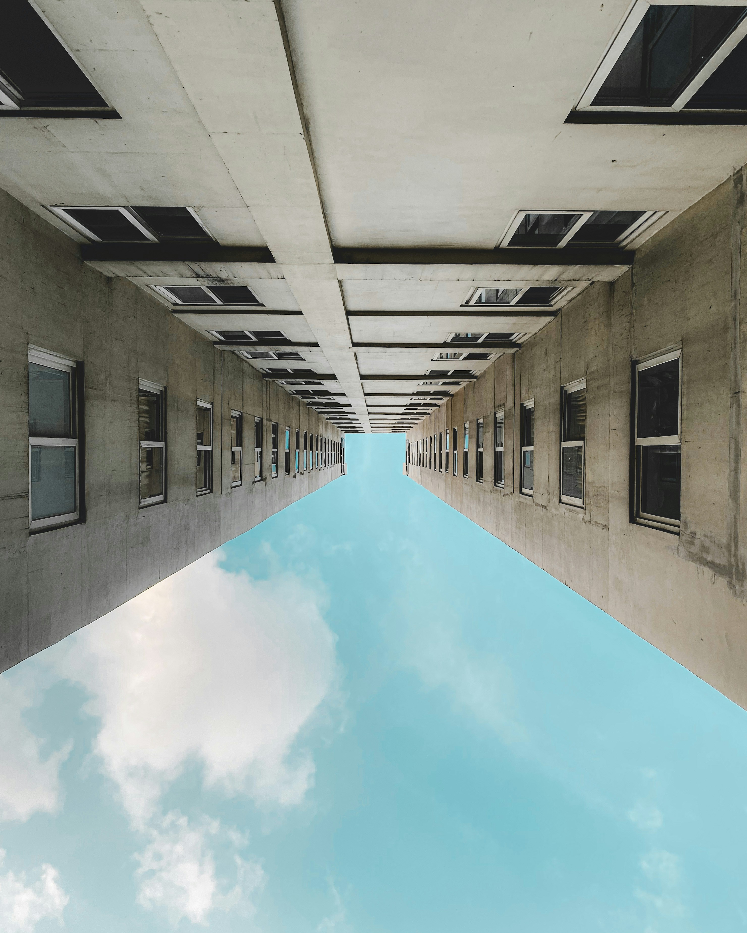 Vanishing Point Between Concrete Wings: A Sky-Reaching Corridor